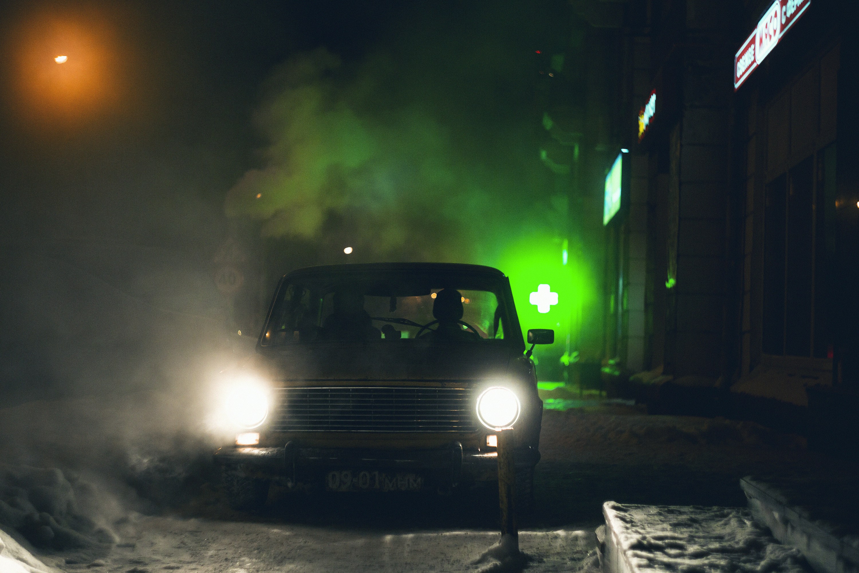 Midnight Rally: Vintage Sedan Cuts Through Neon Fog