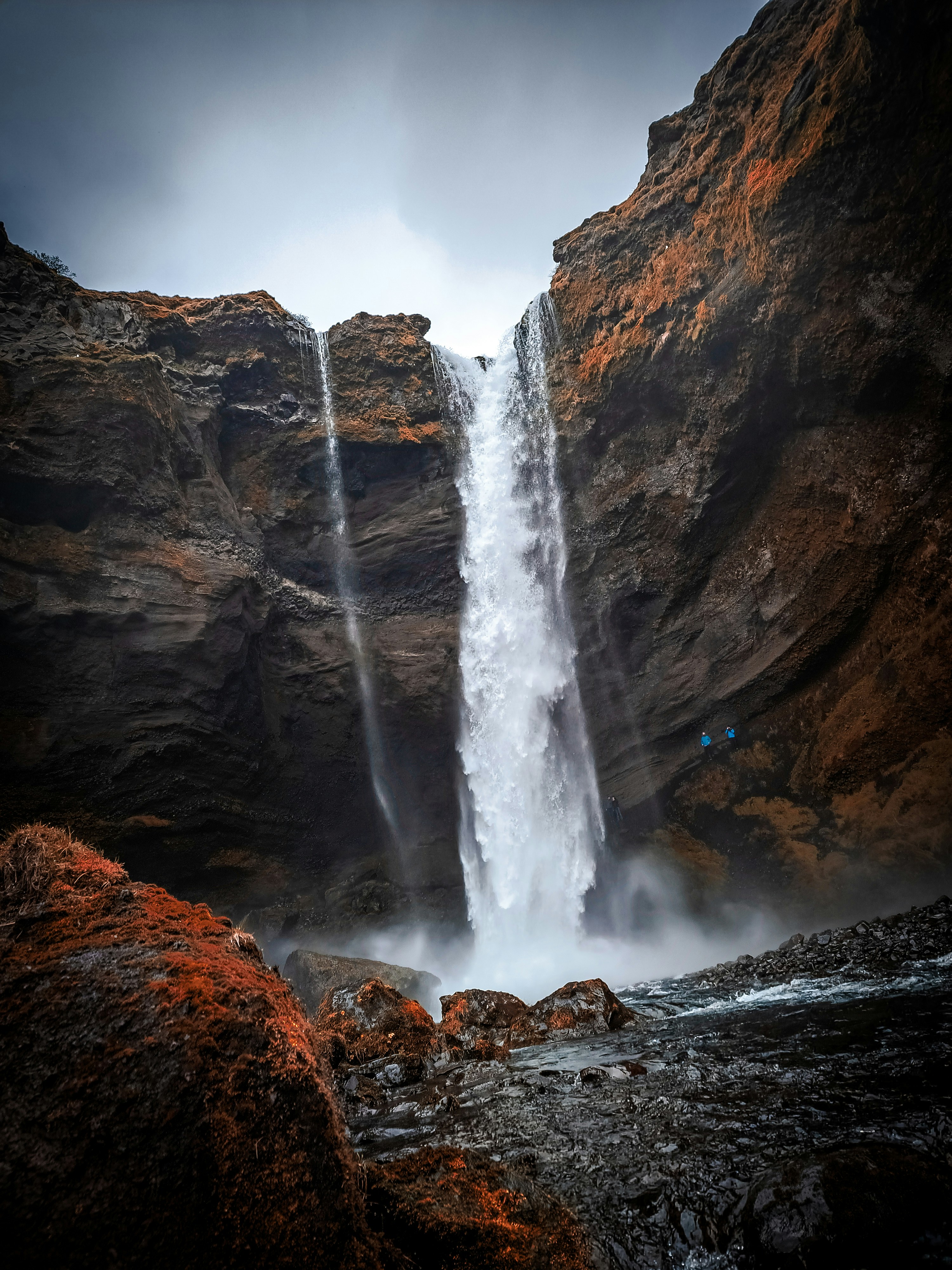 A large waterfall is seen from the ground photo – Free Waterfall Image ...