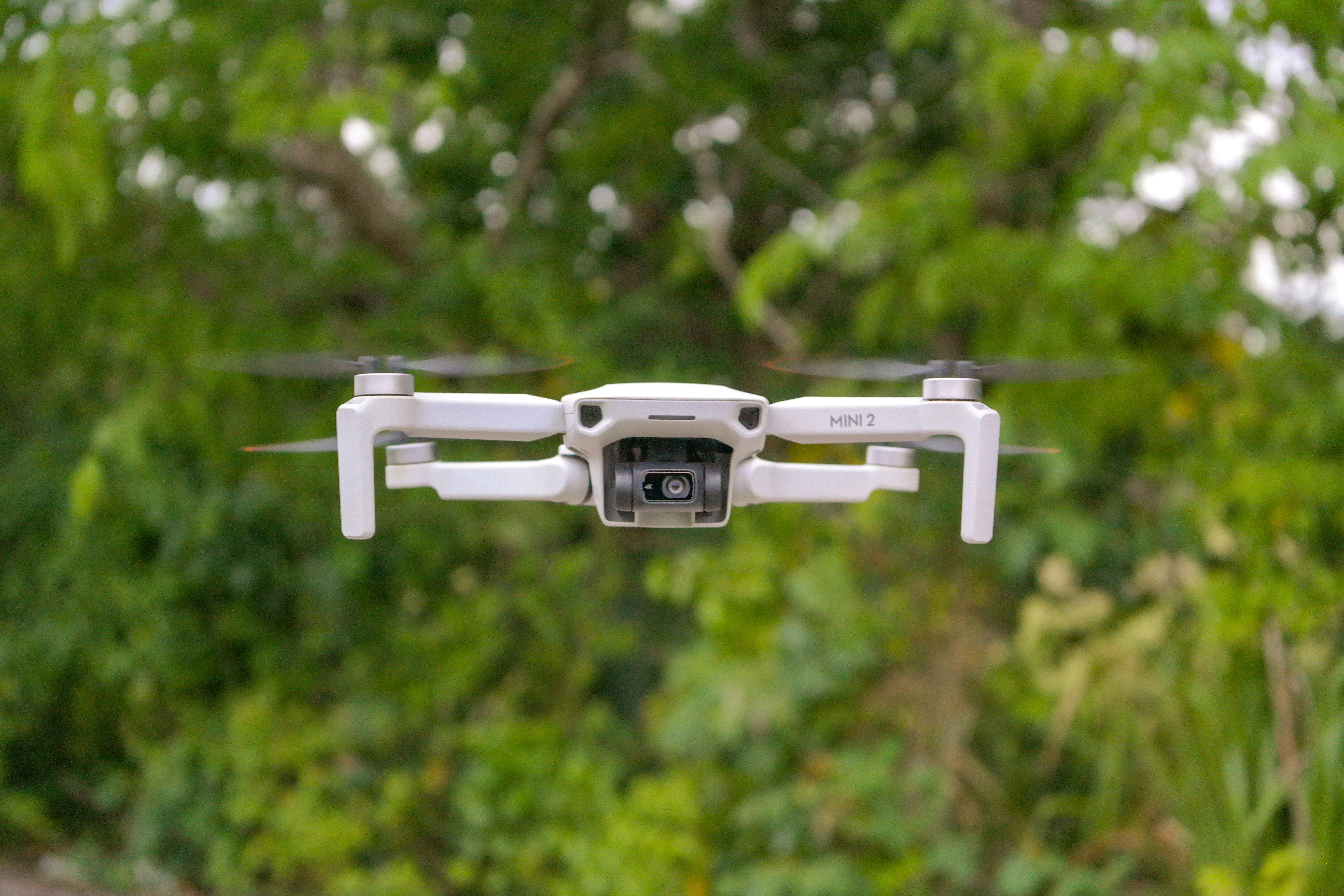 A camera mounted on top of a small white object photo – Free Flying ...