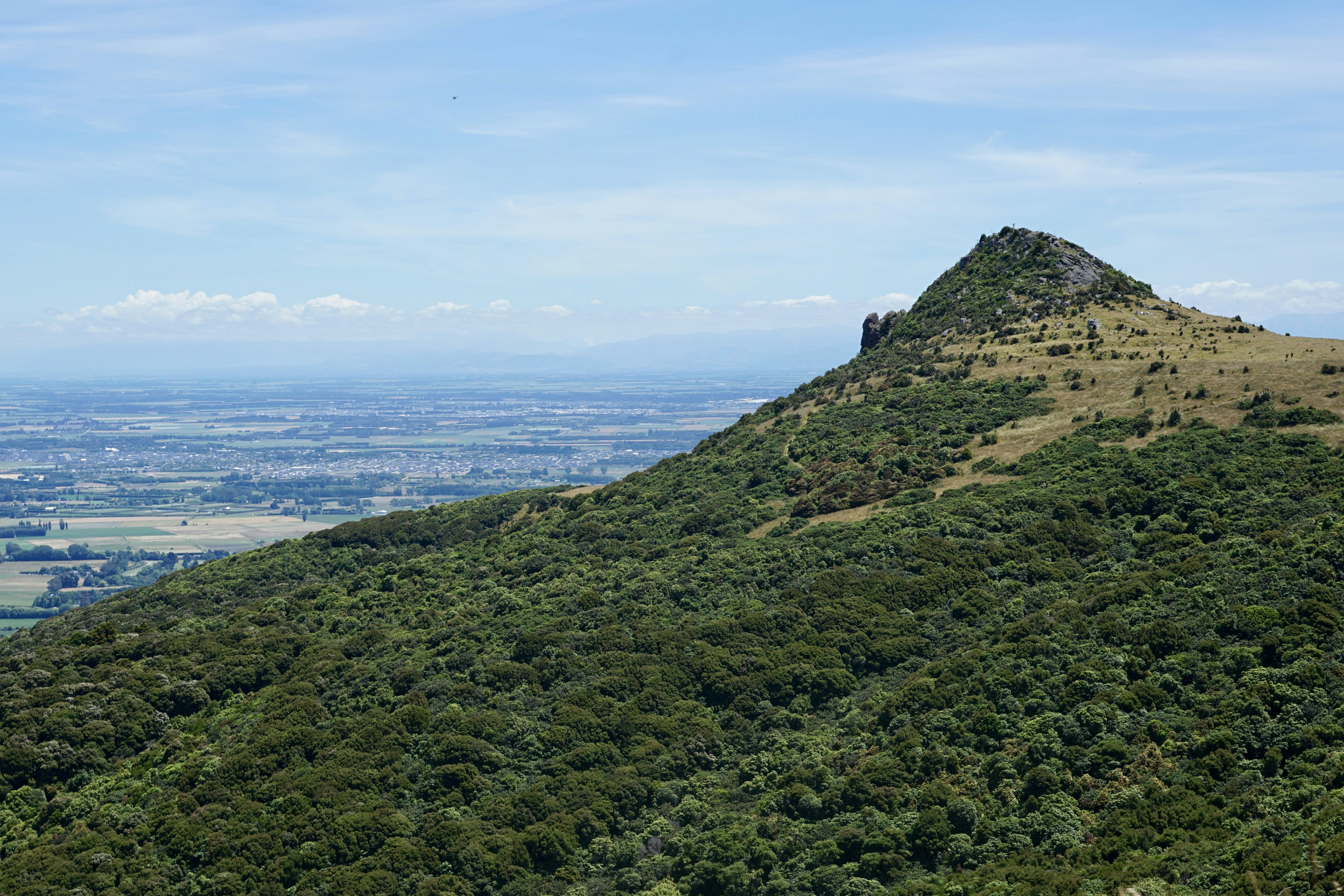 Christchurch 2024 - | a large hill with a small hill on top of it
