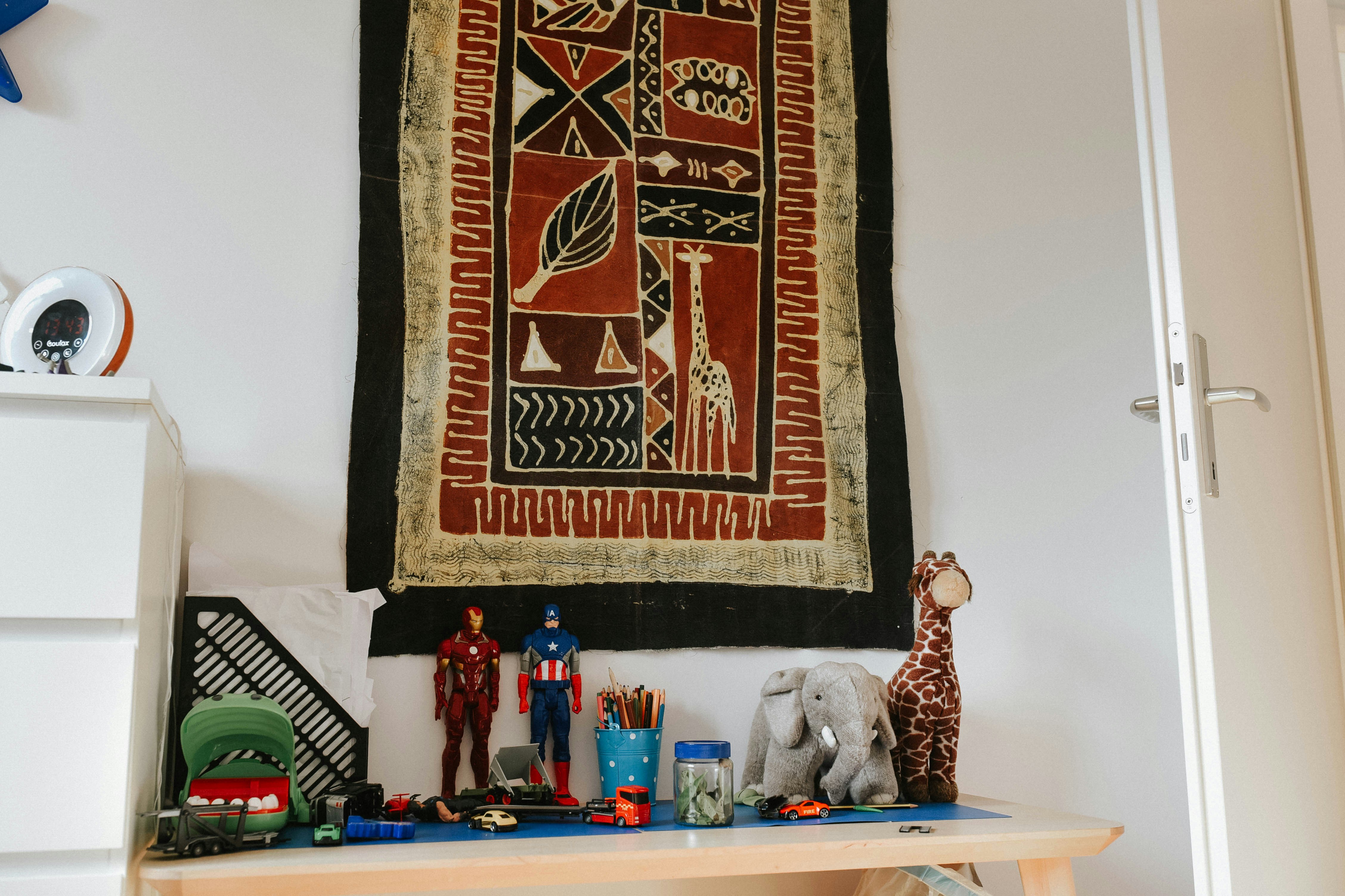 Desk-Top Heroes: Tiny Guardians Under a Woven Banner