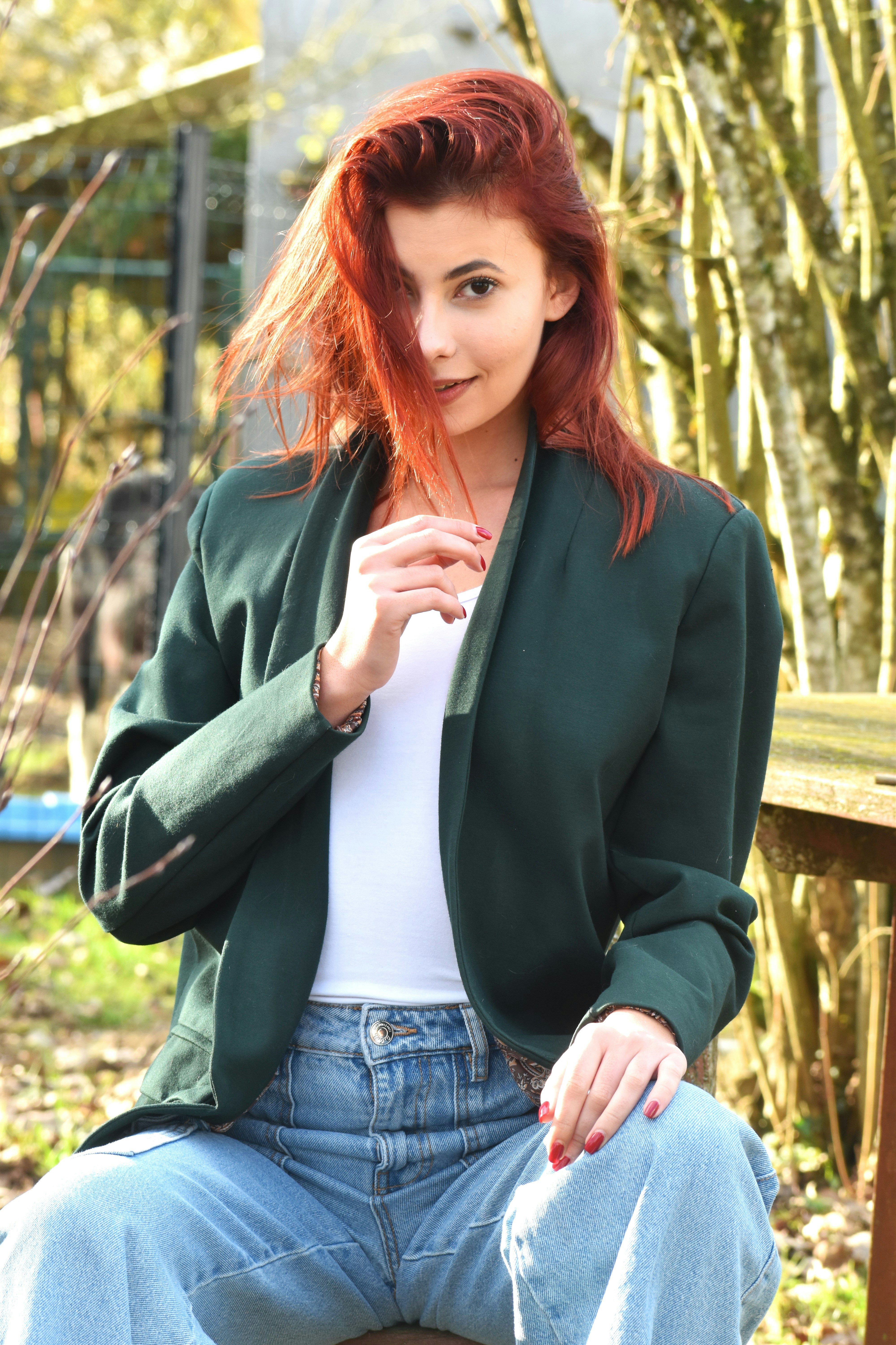 Crimson Locks, Green Blazer: A Sunlit Portrait in the Garden