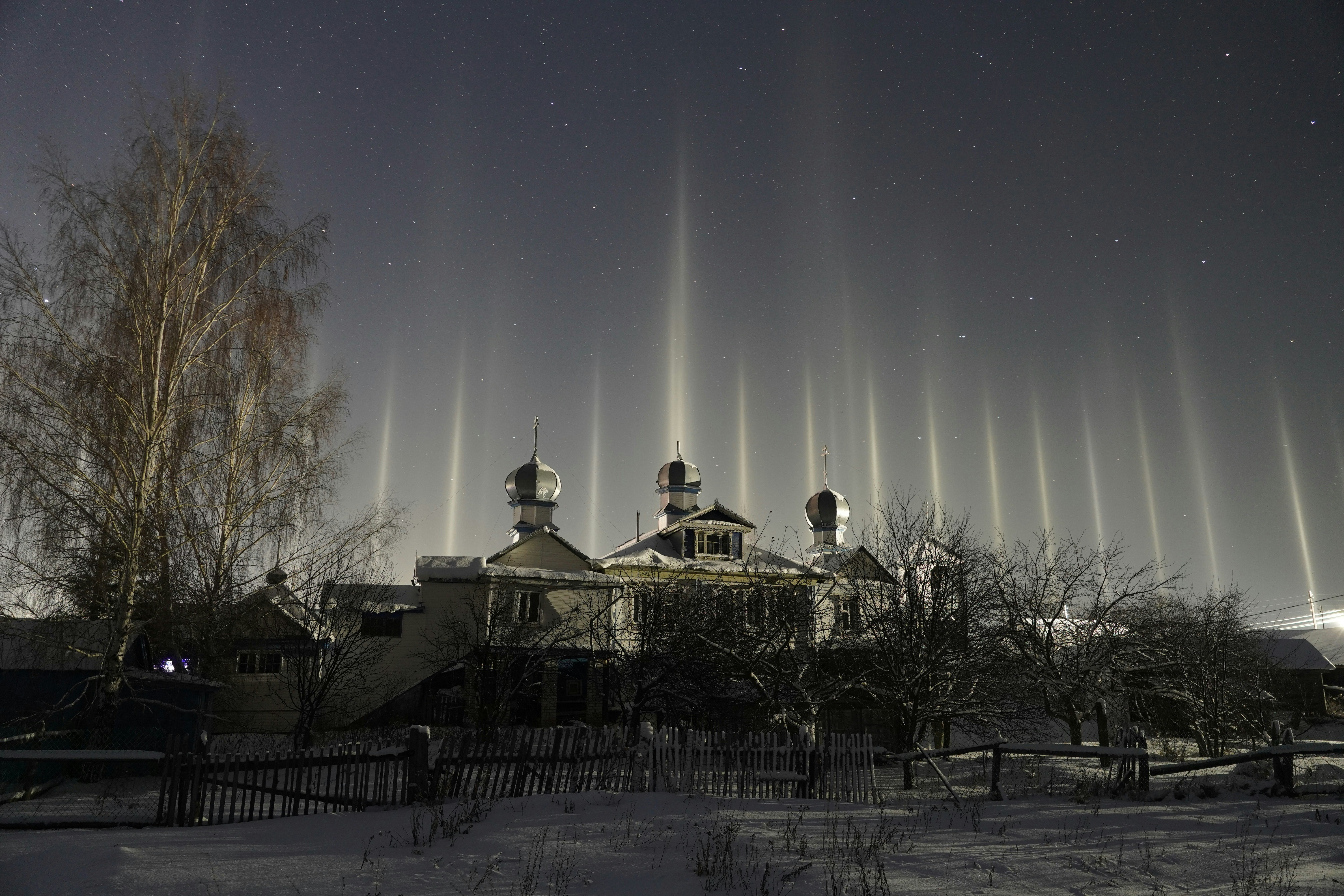 Beams Across a Snowbound Manor: Night Sky Illuminations