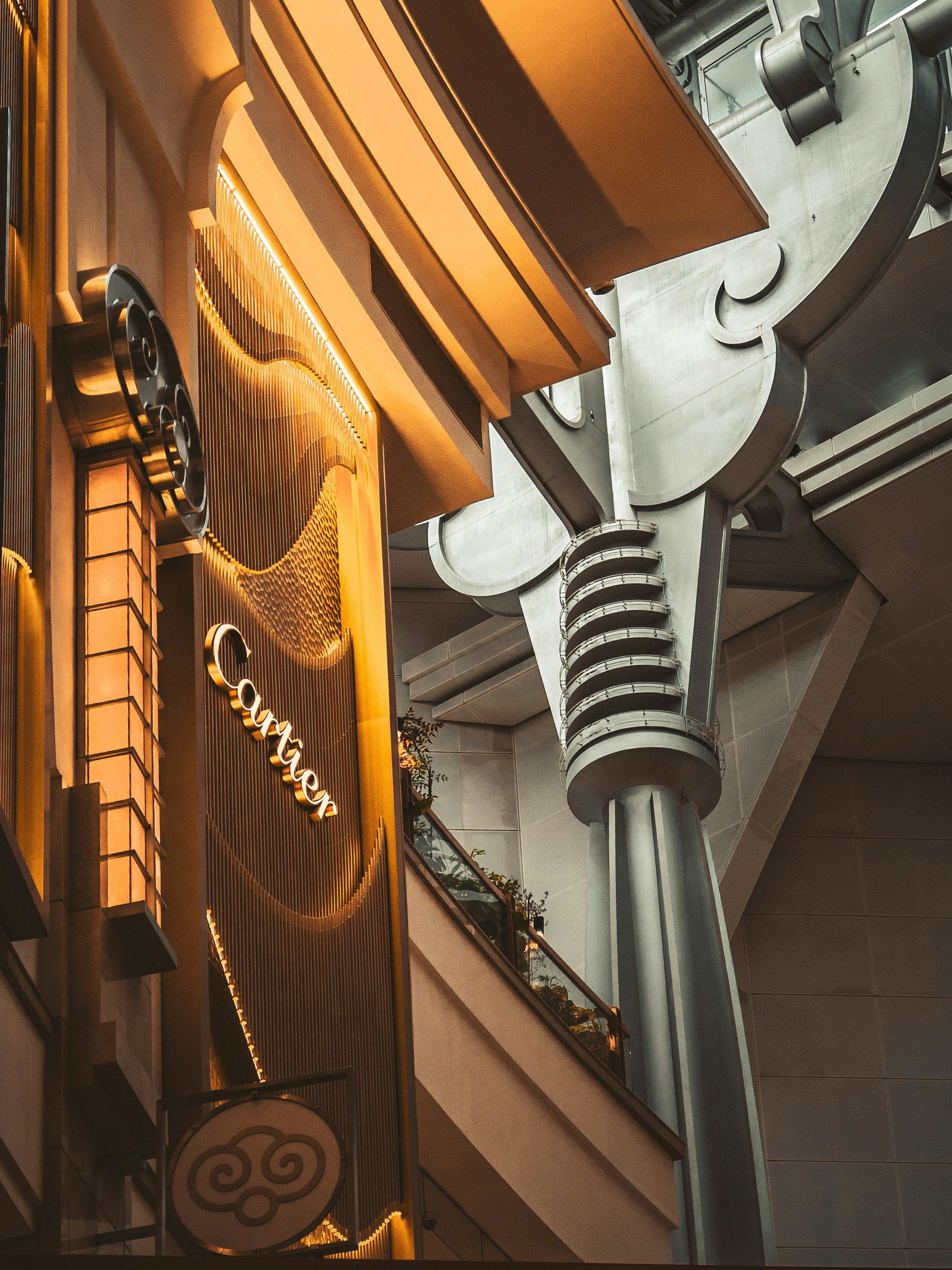 Corner Sign in Amber Halo Beside Looming Steel Structure