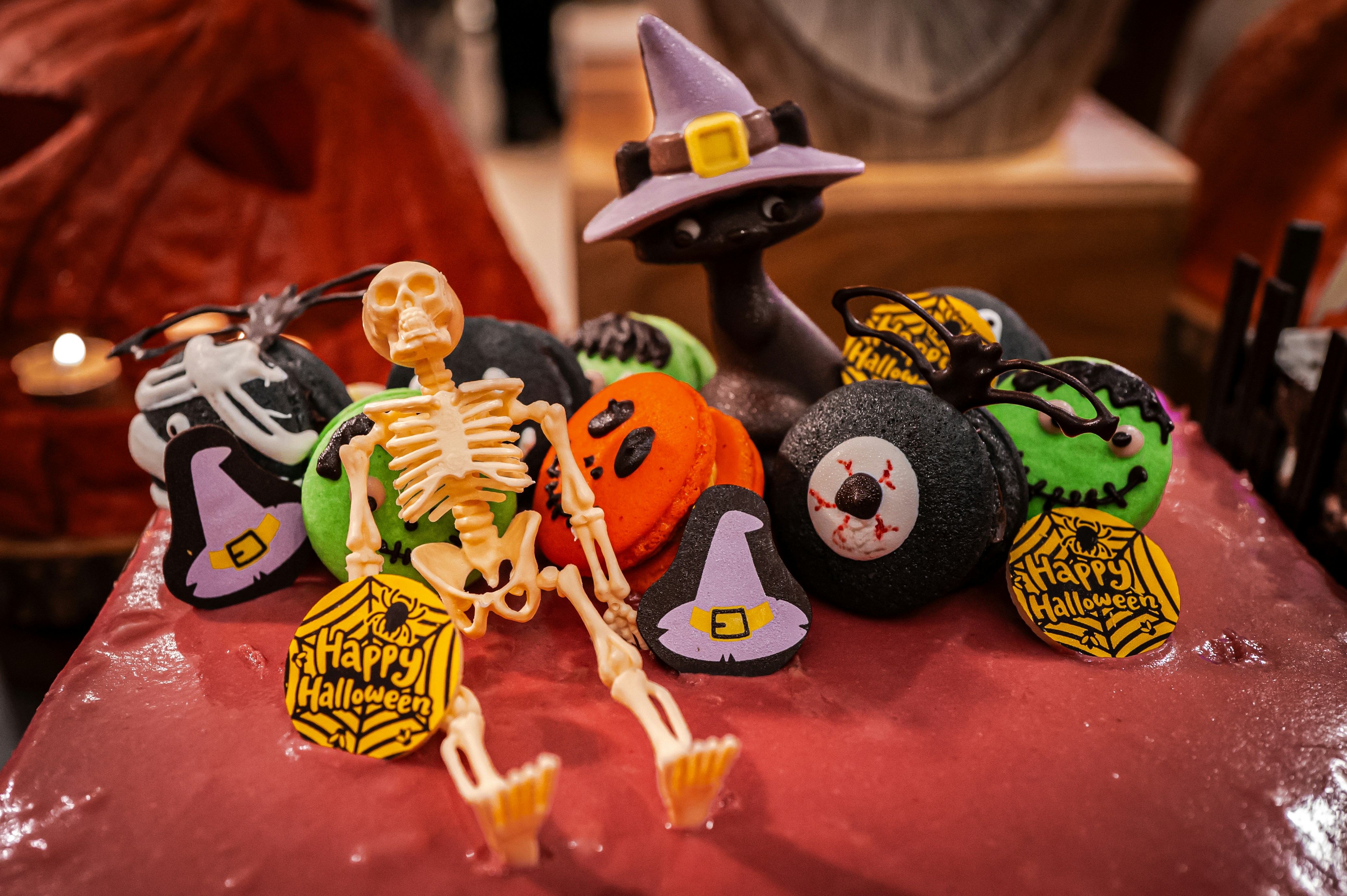 Skeleton Parade on a Crimson Halloween Cake