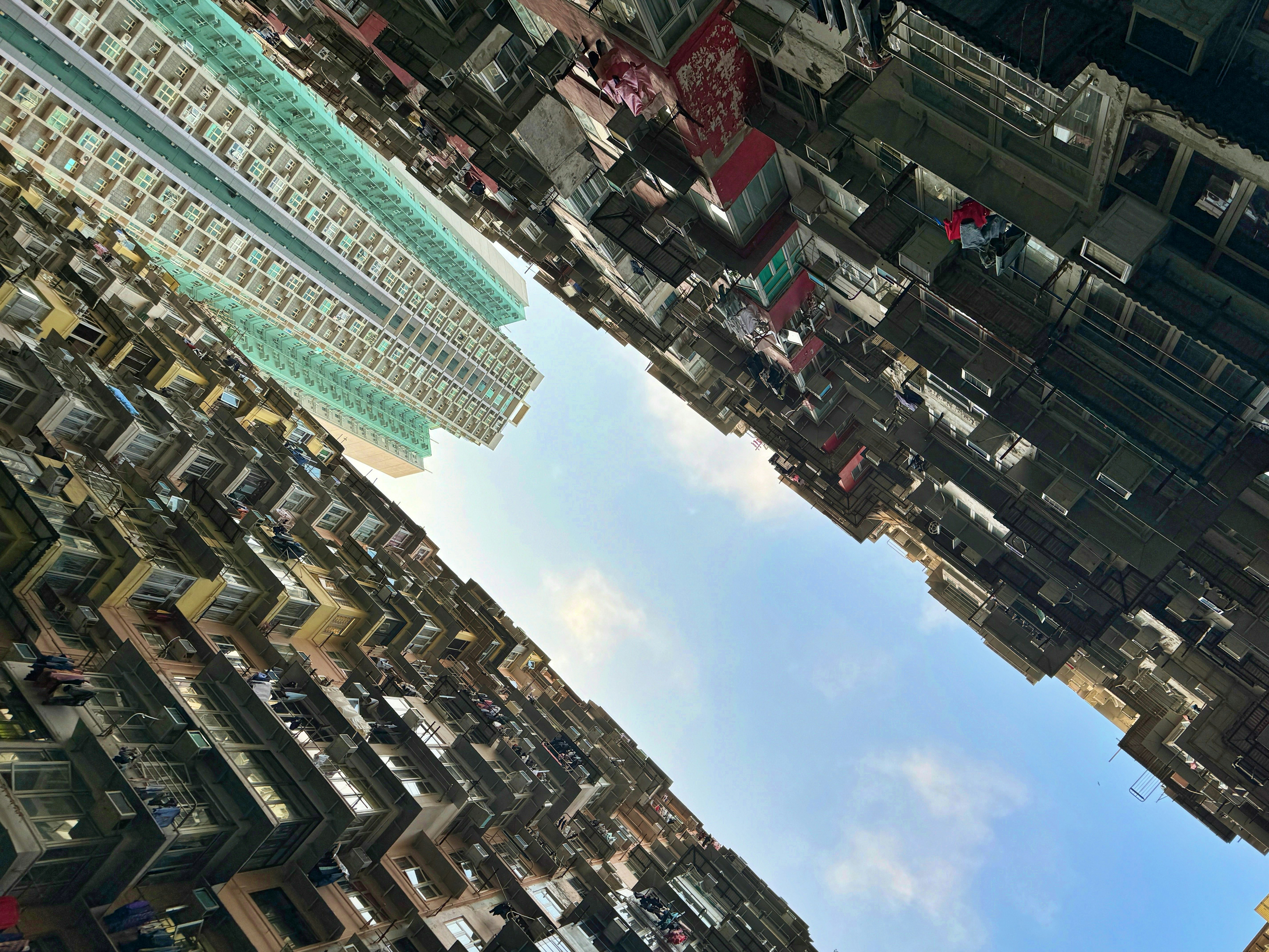 Azure Sky Framed by Towering Facades