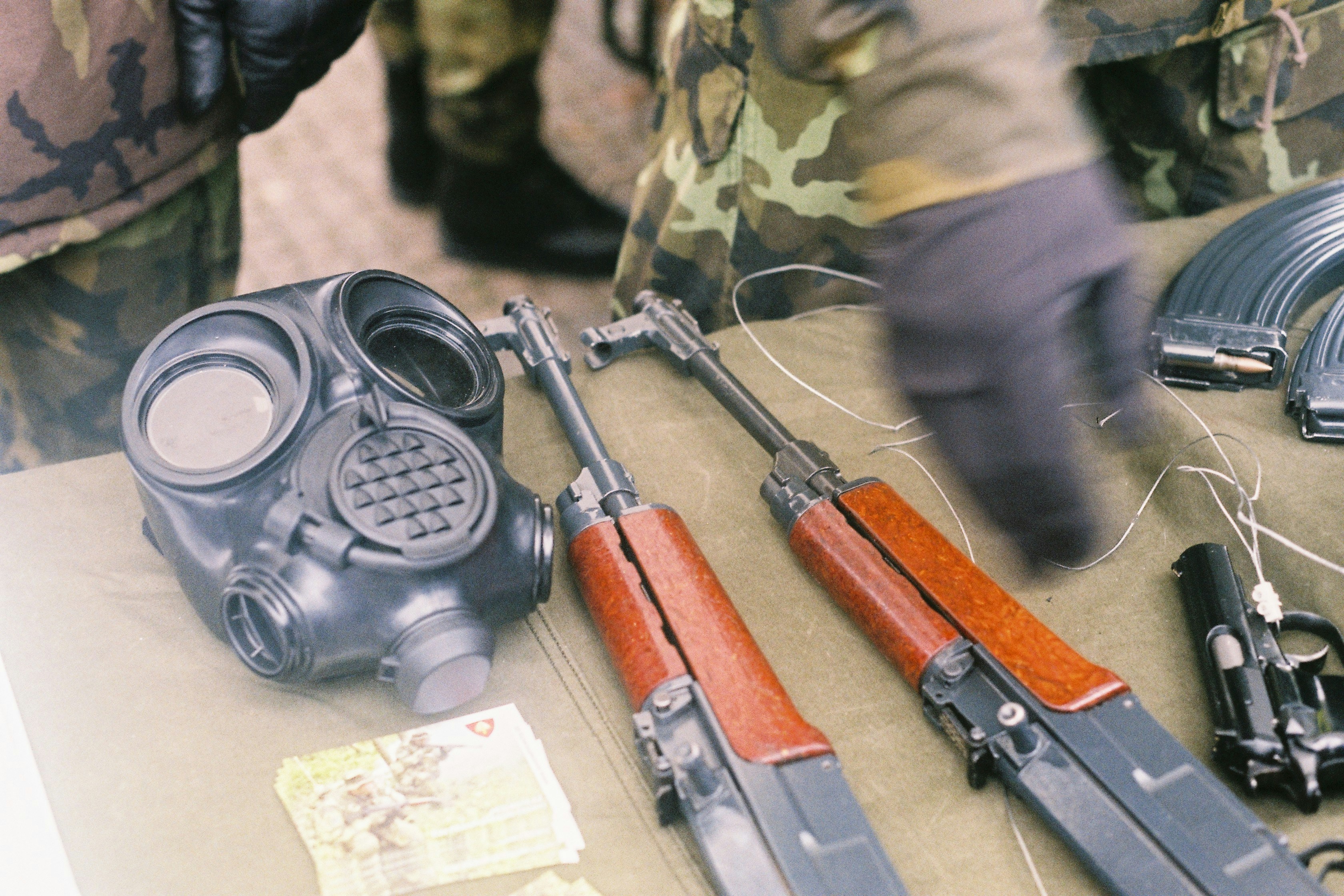 A table topped with guns and gas masks photo – Free Czechia Image on ...