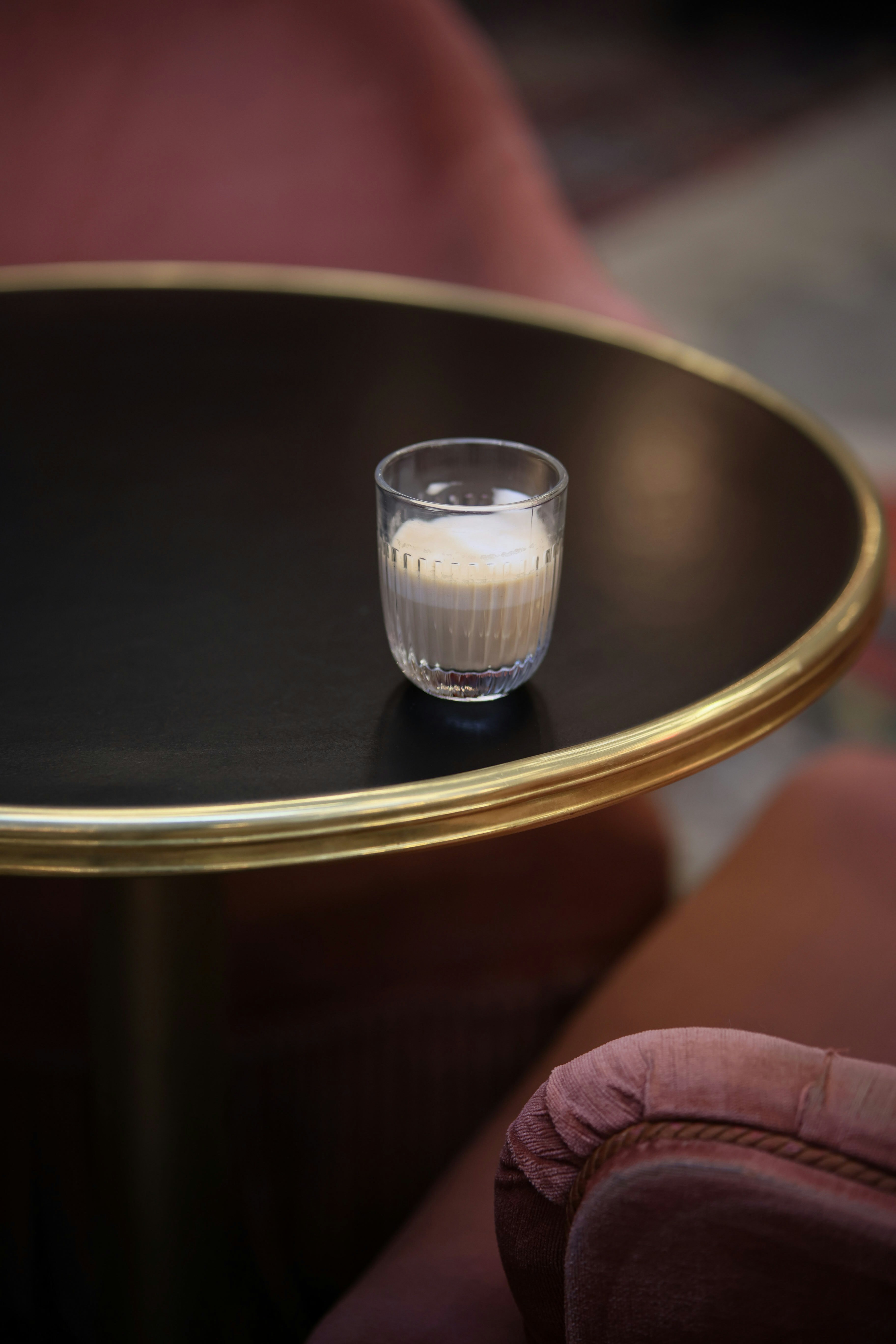 Centered Glass on a Gold-Rimmed Round Table