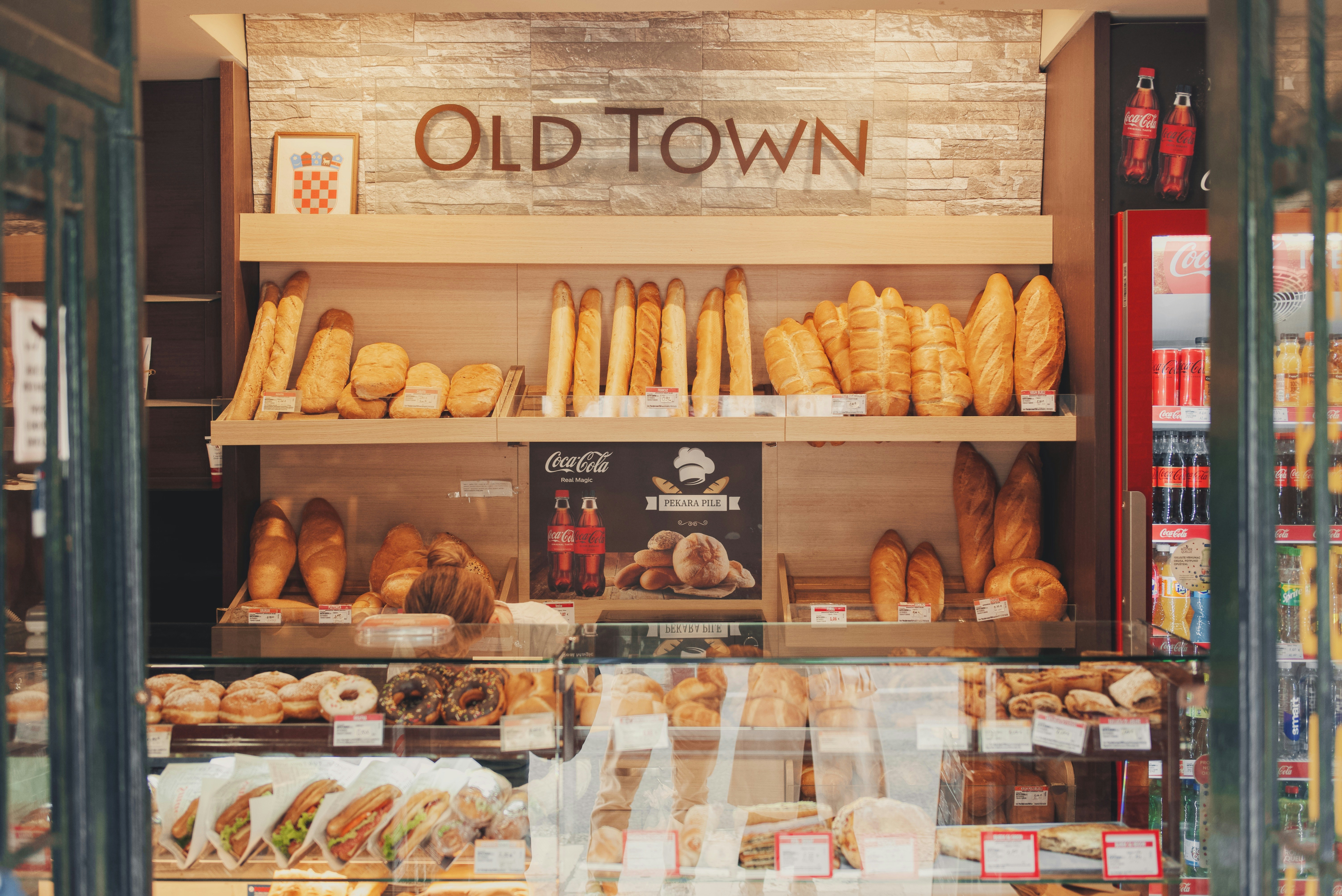 A bakery filled with lots of different types of bread photo – Free ...