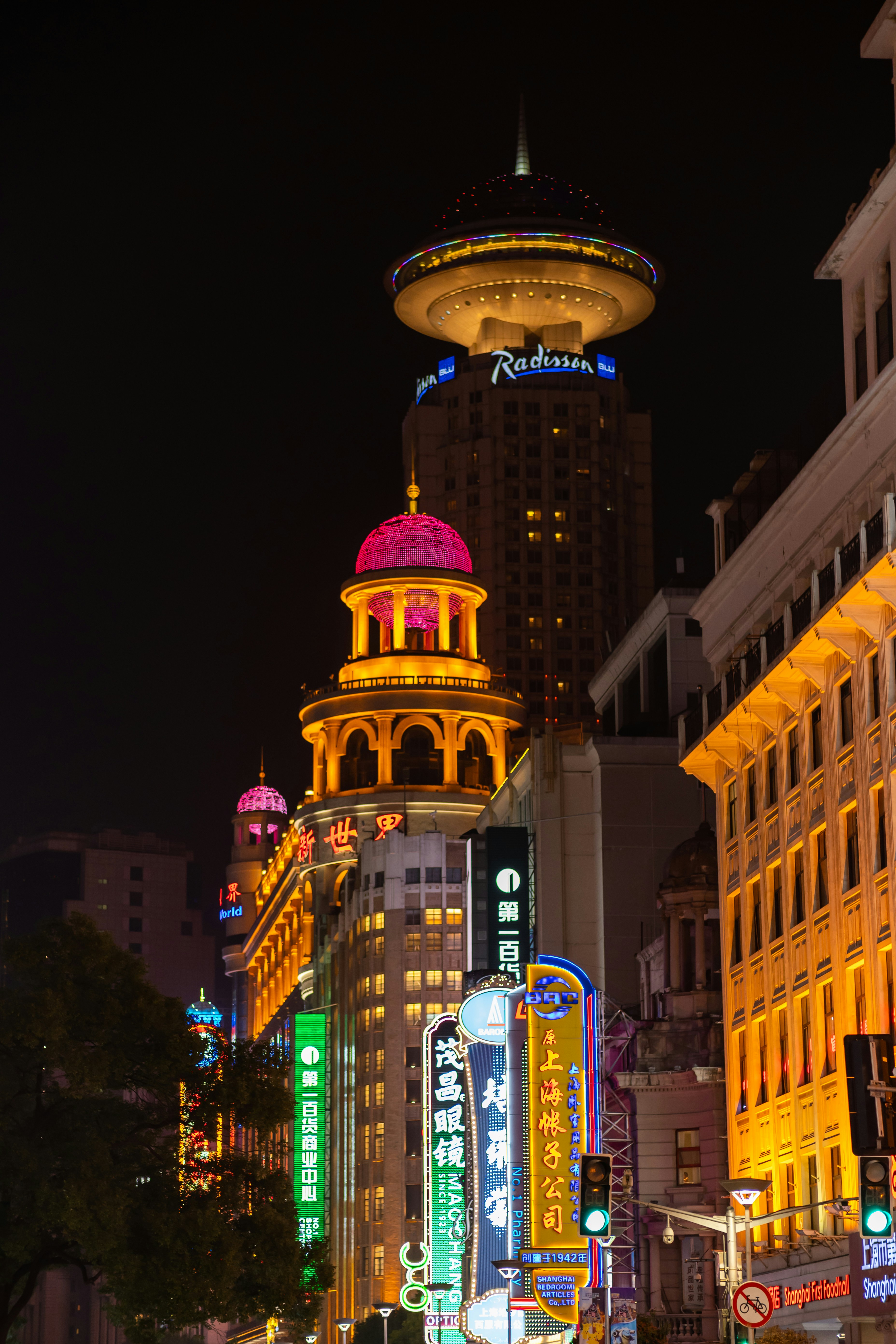 Pink Dome Rising Over a Neon City Block