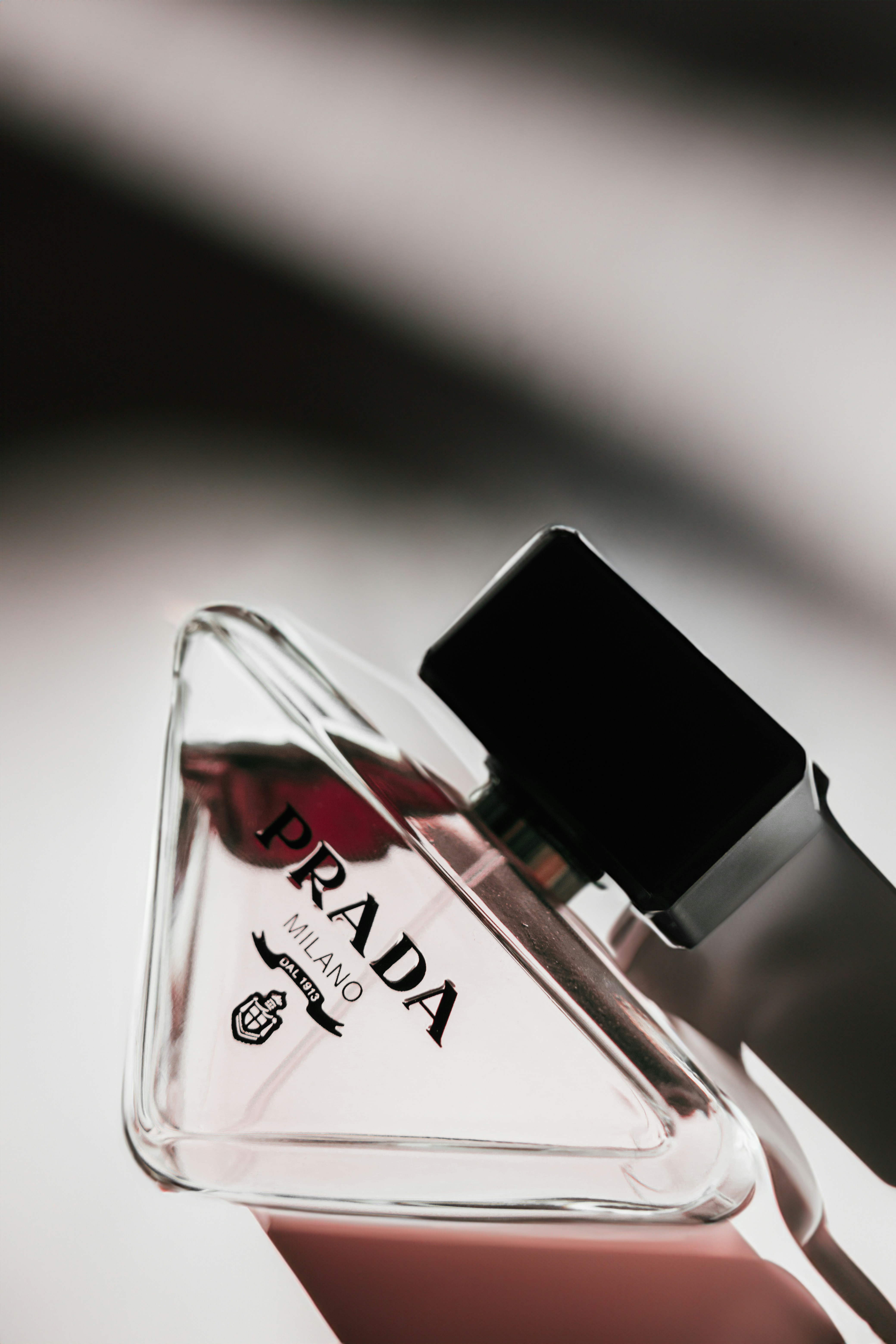 A bottle of perfume sitting on top of a table photo – Free Bottle Image ...