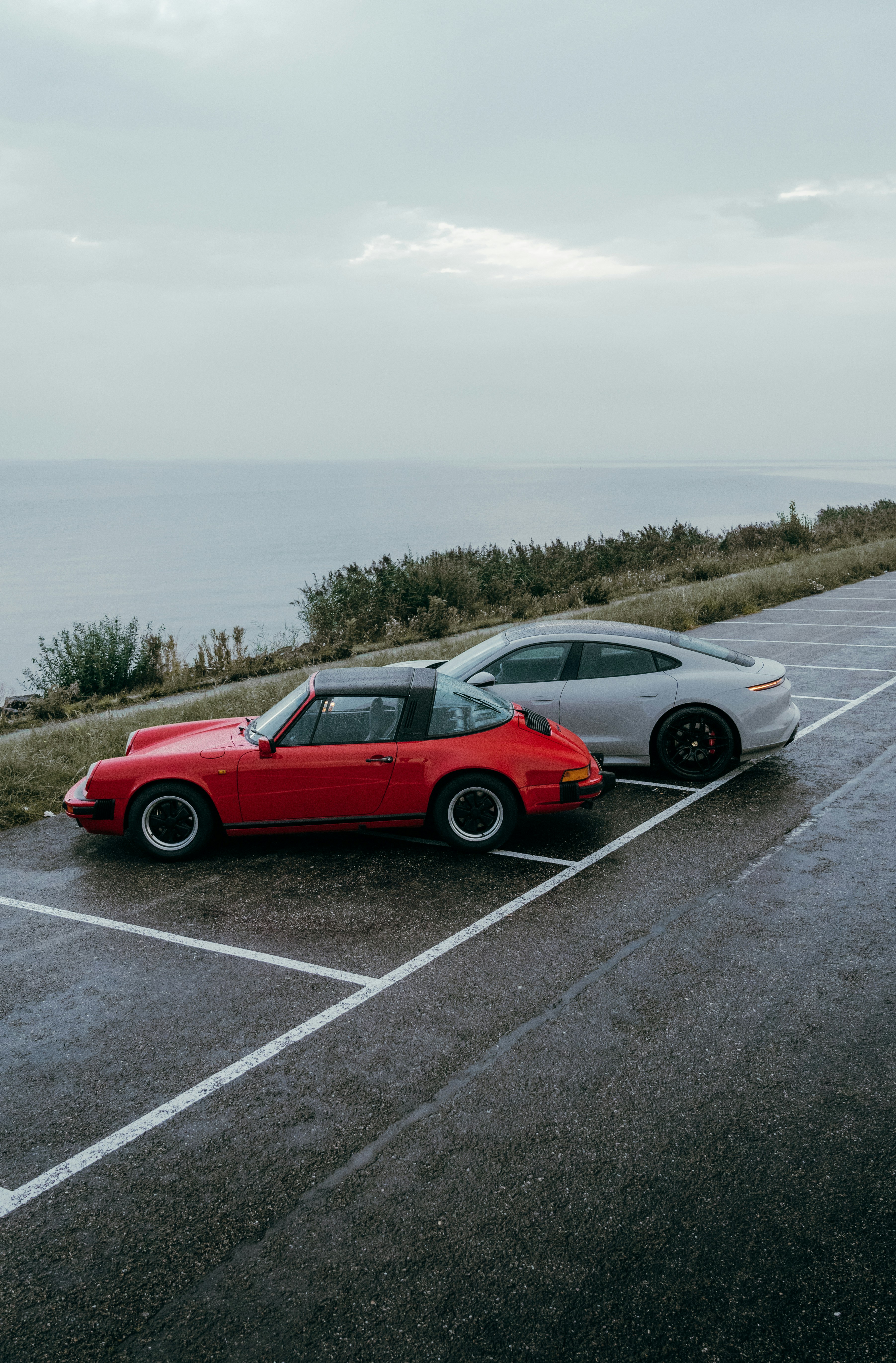 Red Porsche at the Edge: A Sea-Side Parking Lot Portrait