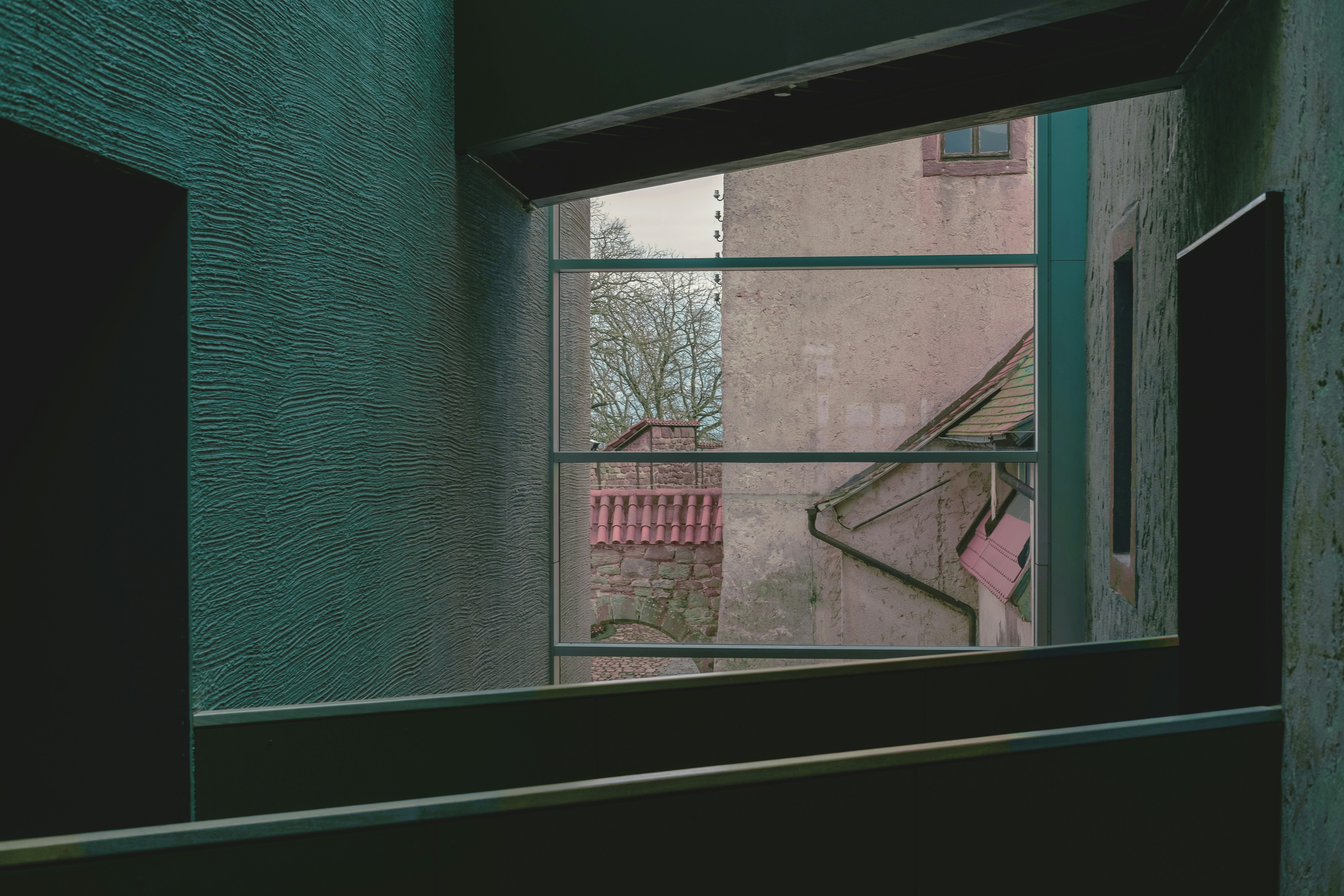A view of a building through a window photo – Free Germany Image on ...