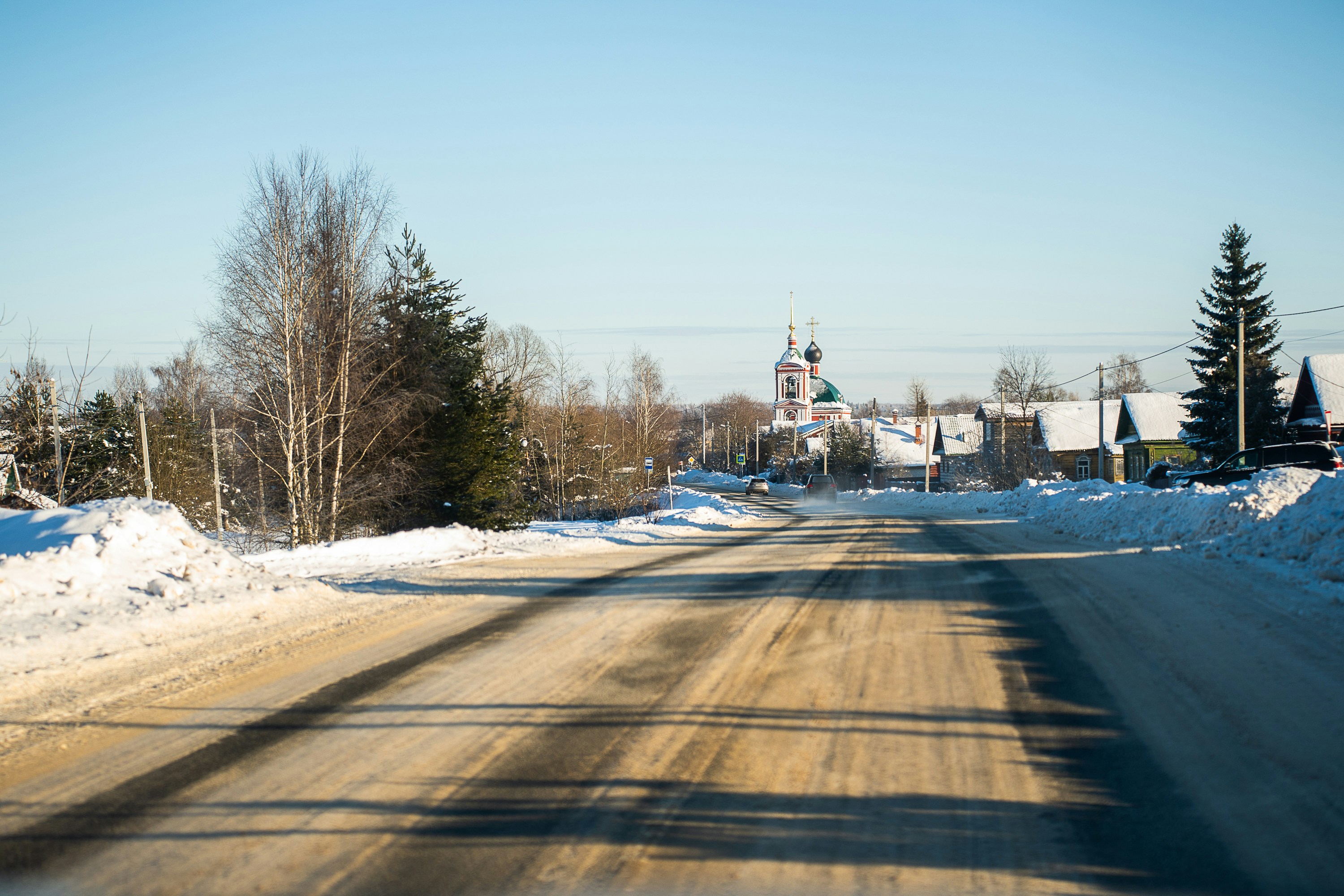 Dawn on a Snowbound Village Street Leading to the Church