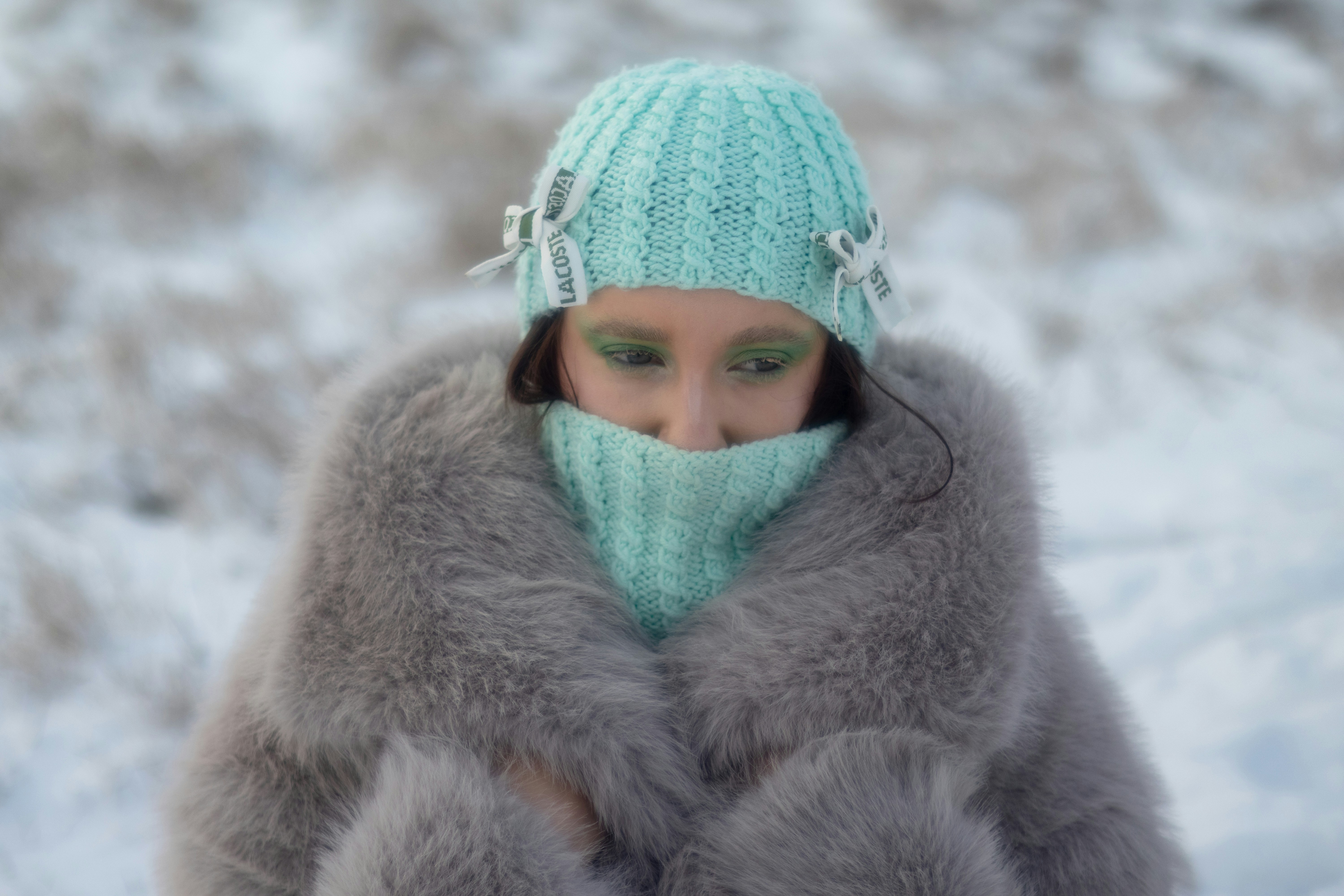 A woman wearing a scarf and a hat in the snow photo – Free Ukraine ...