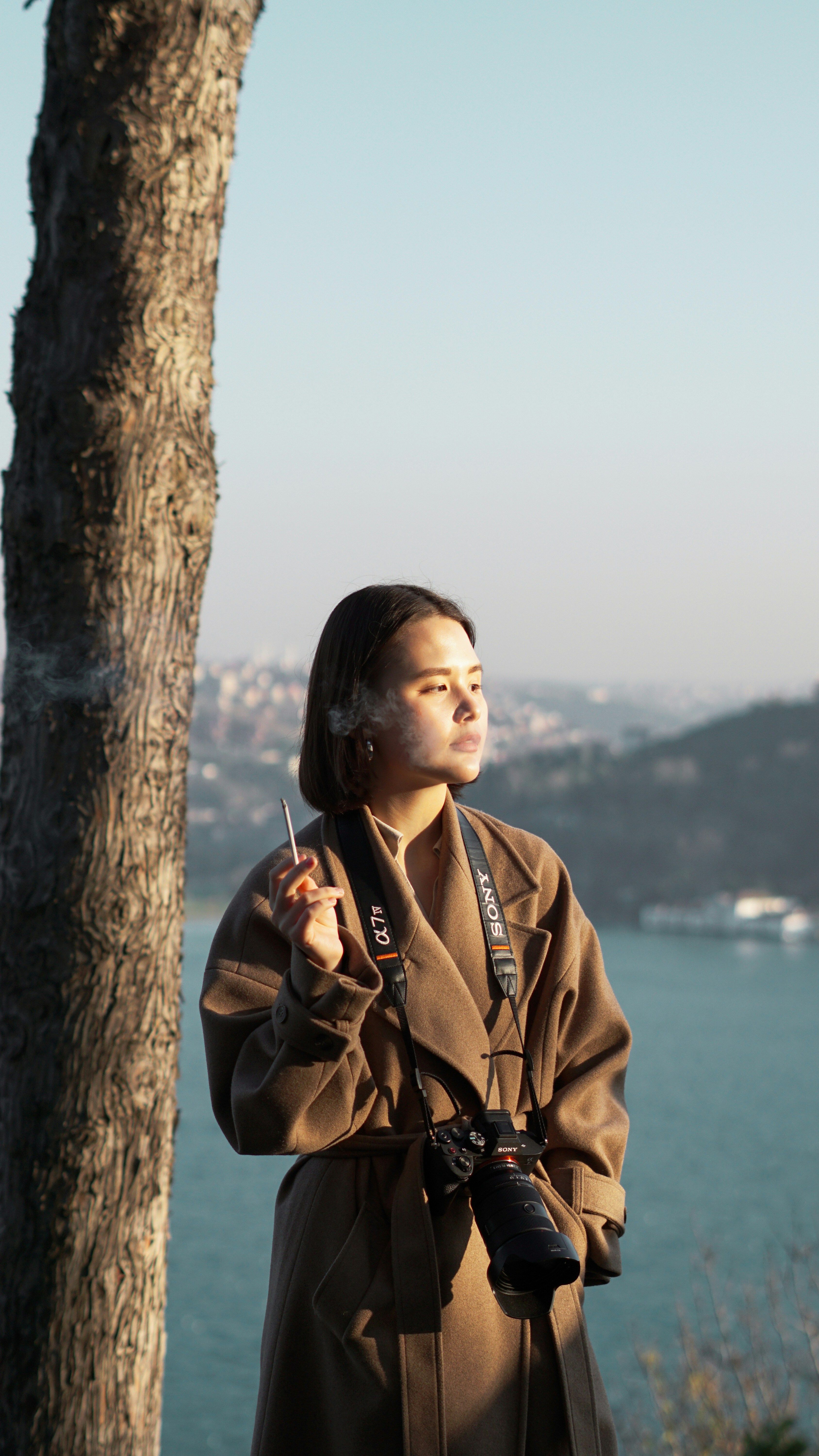 Horizon Gaze by the Coastal Tree: a Quiet Portrait in Warm Light