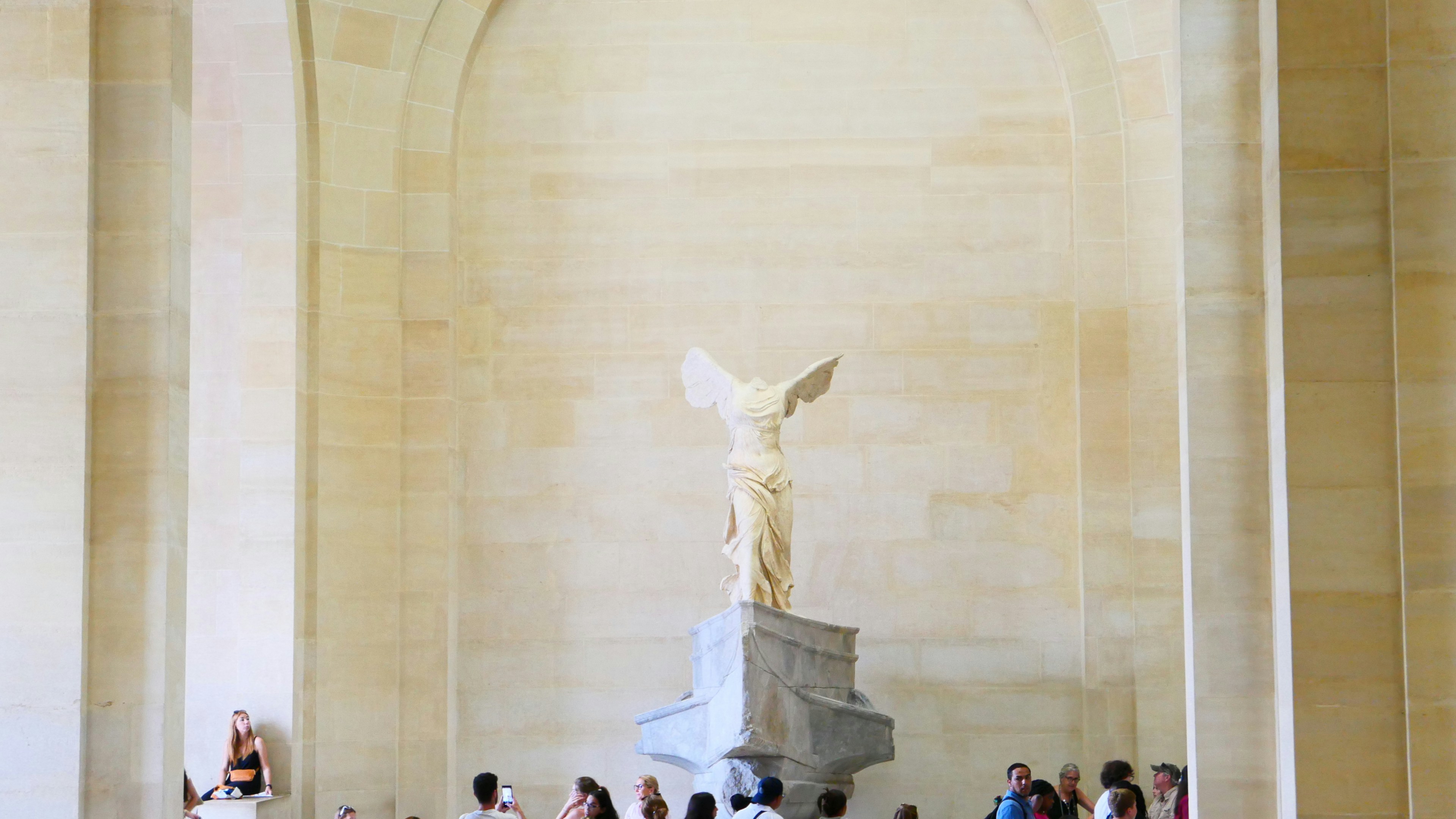 A group of people standing around a statue photo – Free Louvre museum ...