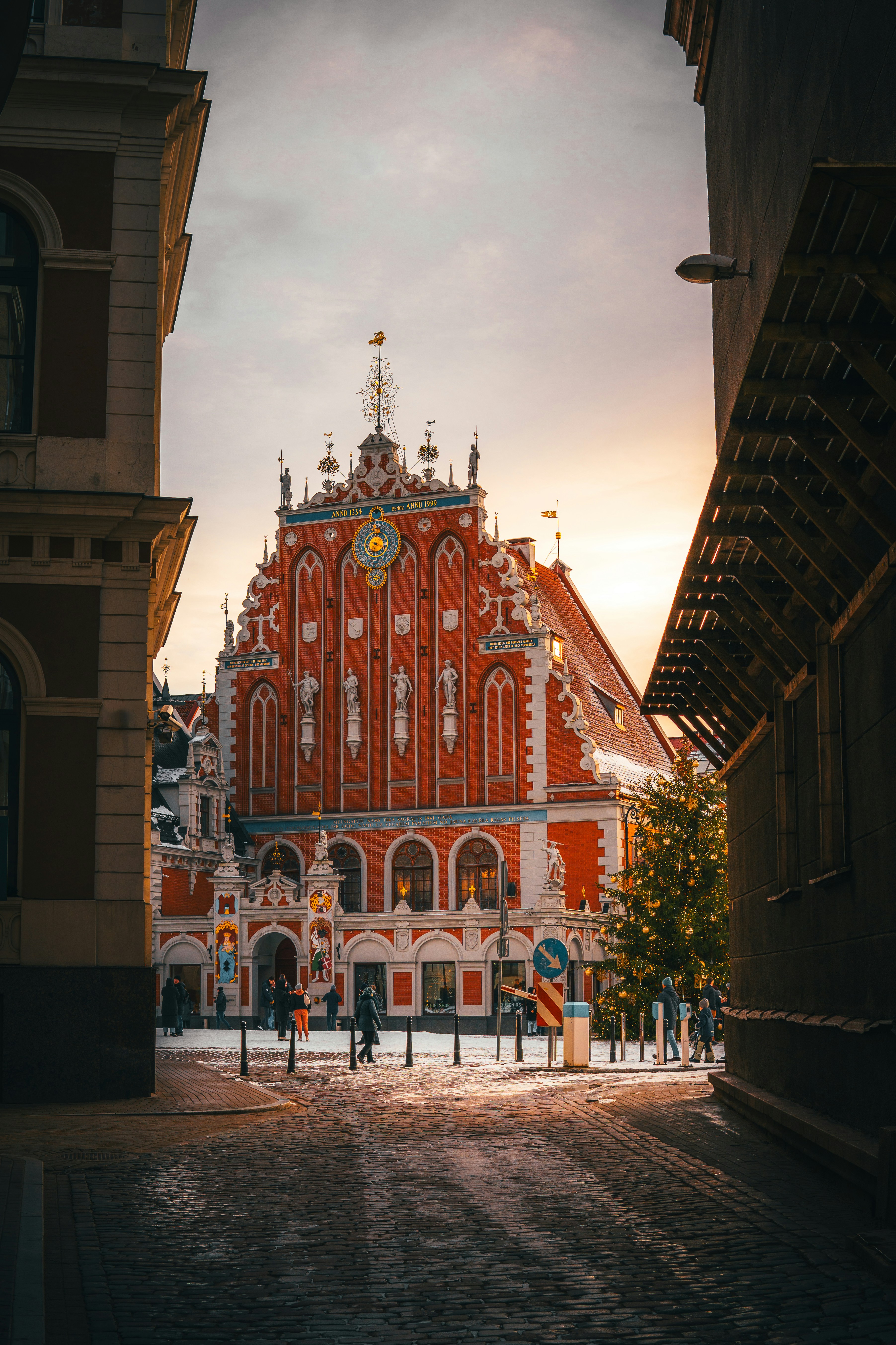 A large red building with a clock on it's side photo – Free Riga Image ...