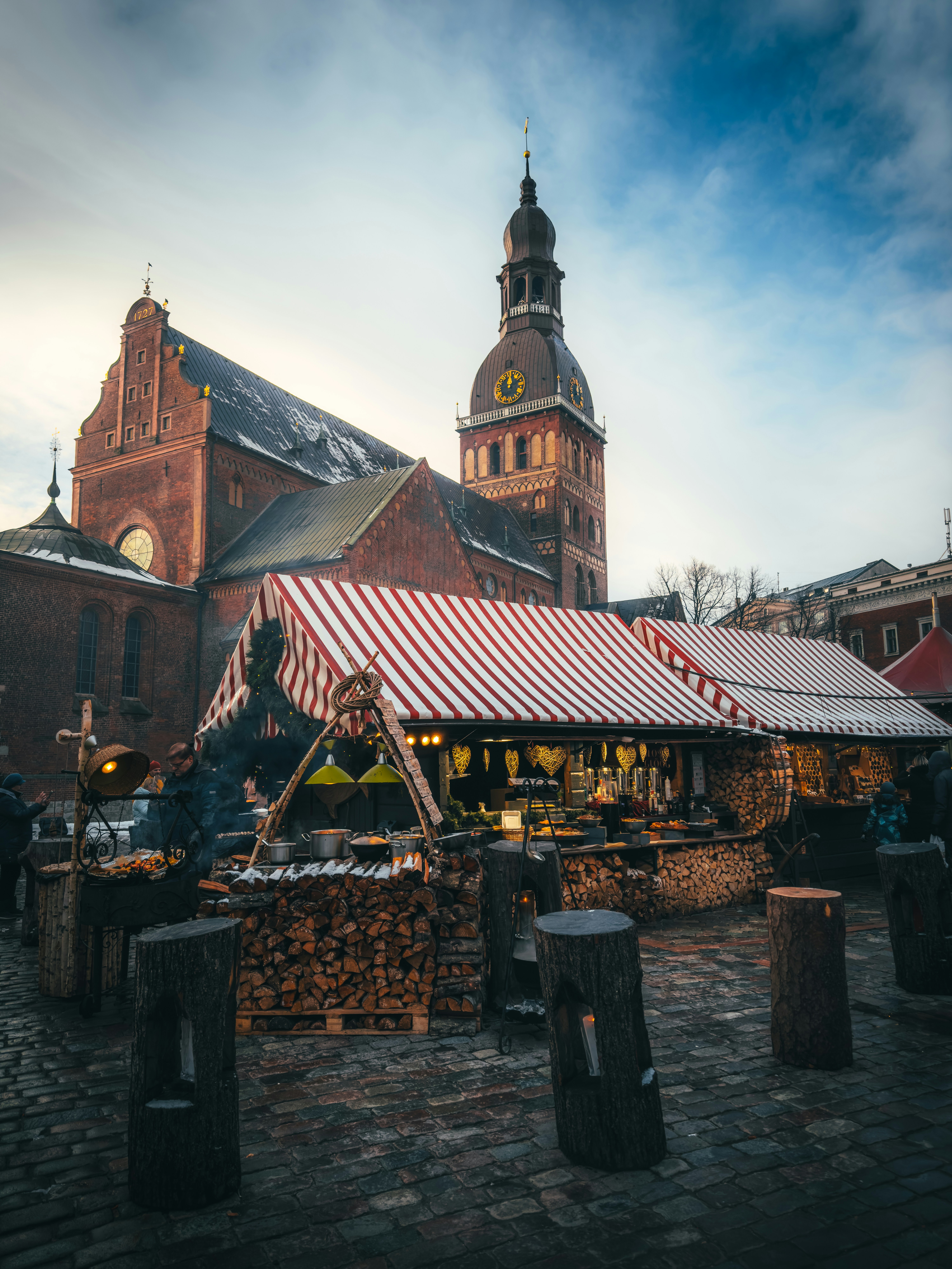 Striped Canopy, Timeless Clocktower: Market Lights in a Historic Square