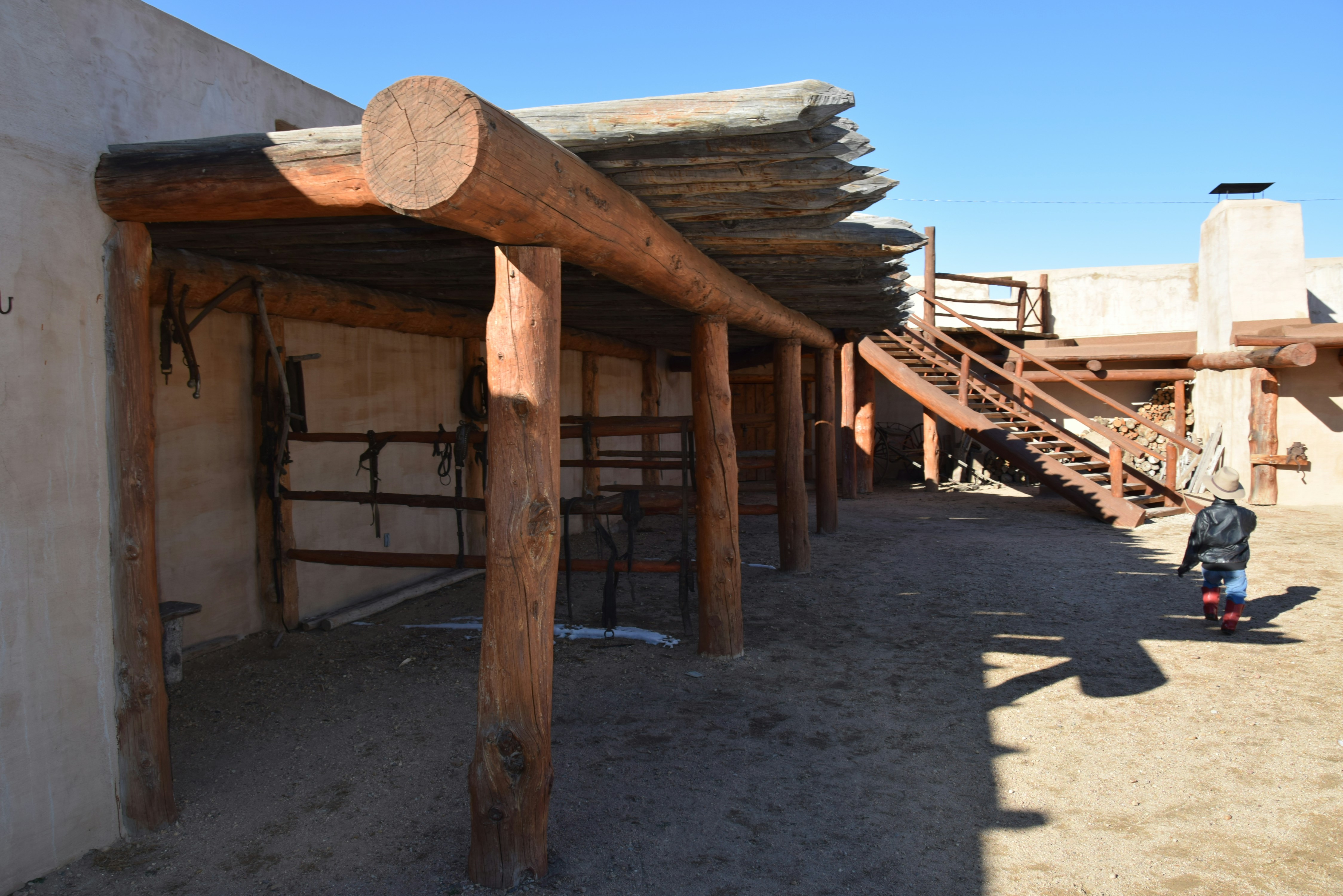 A small child is standing in front of a building photo – Free Fort ...