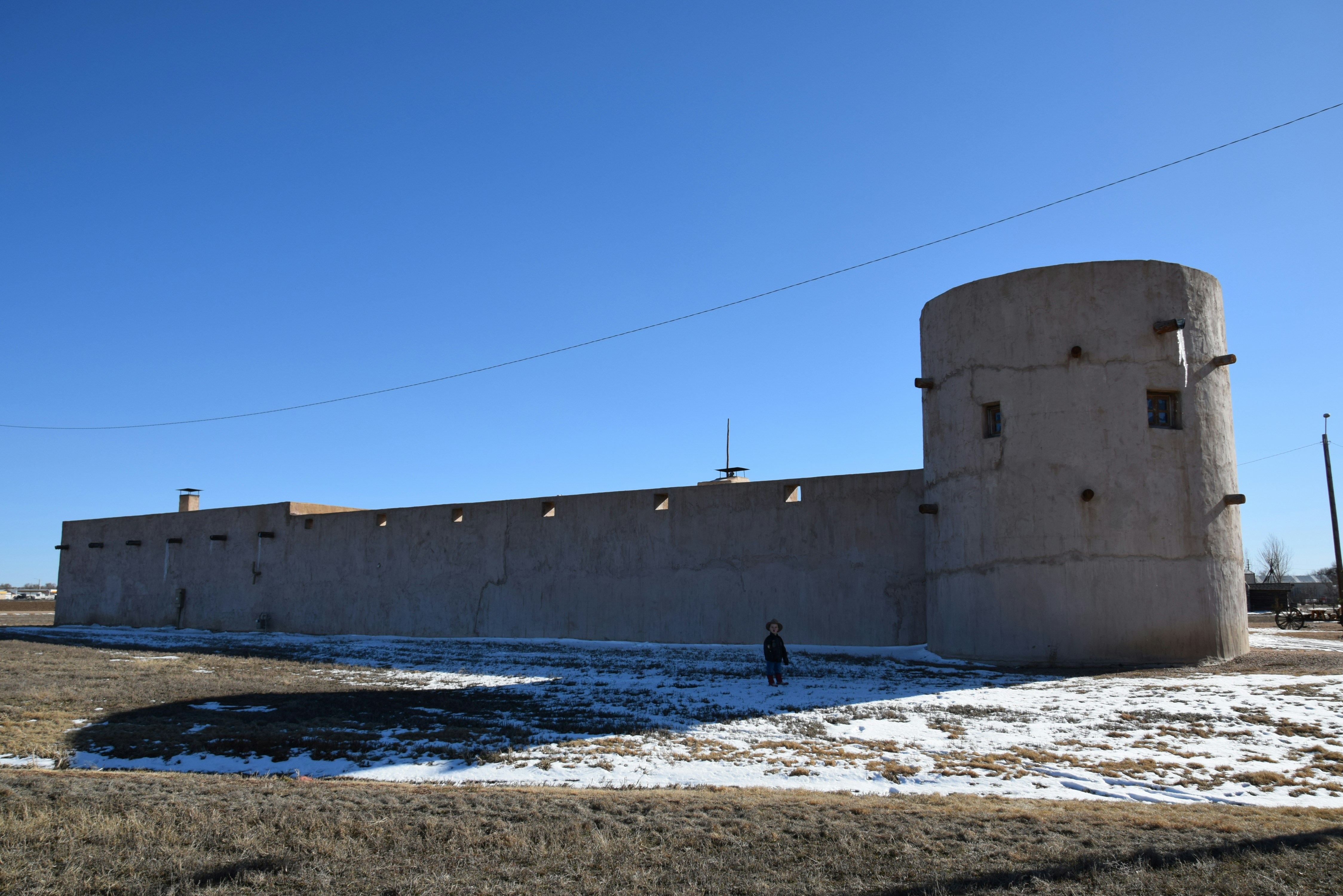 A man standing in front of a large building photo – Free Fort lupton ...