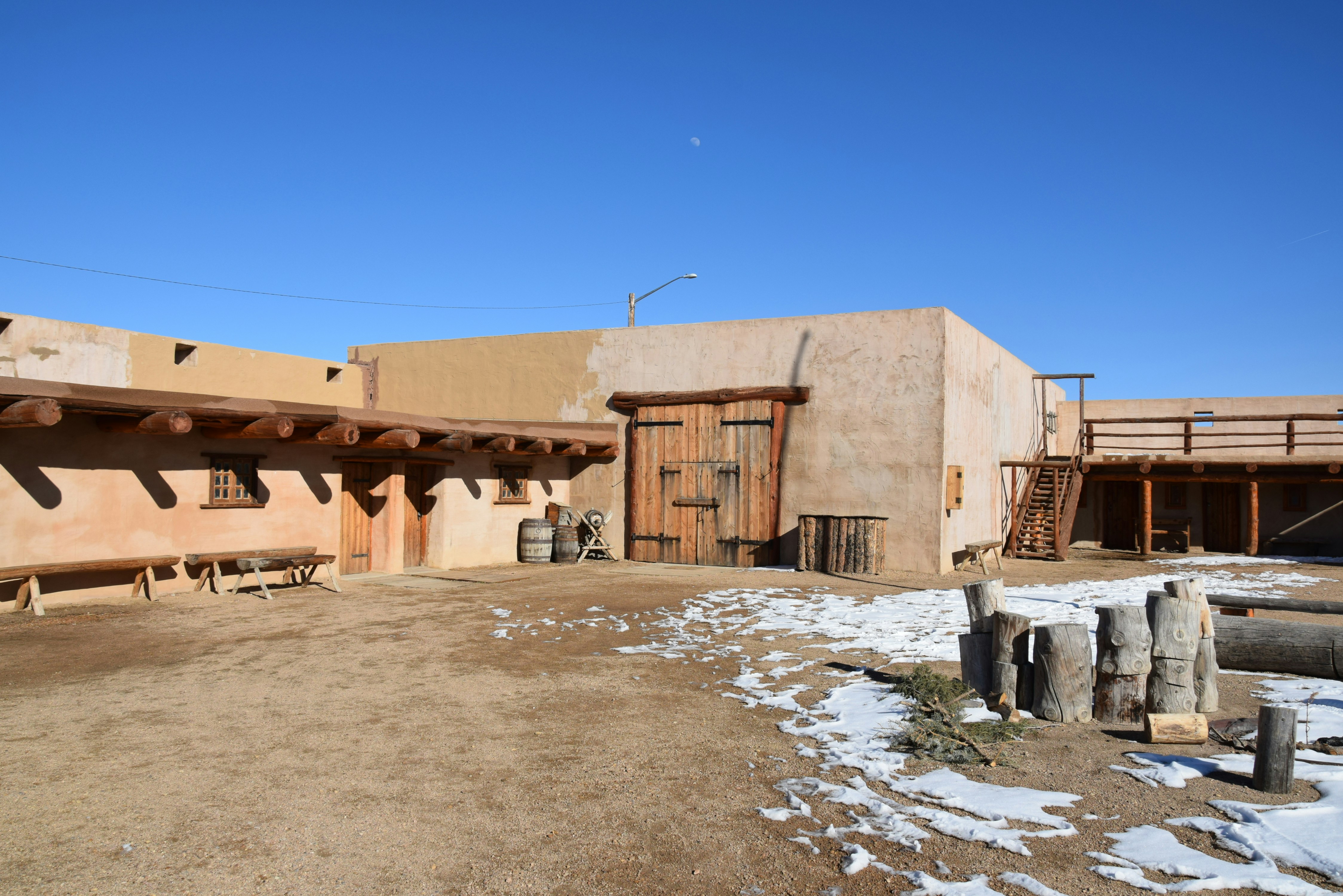 A building with a lot of snow on the ground photo – Free Fort lupton ...