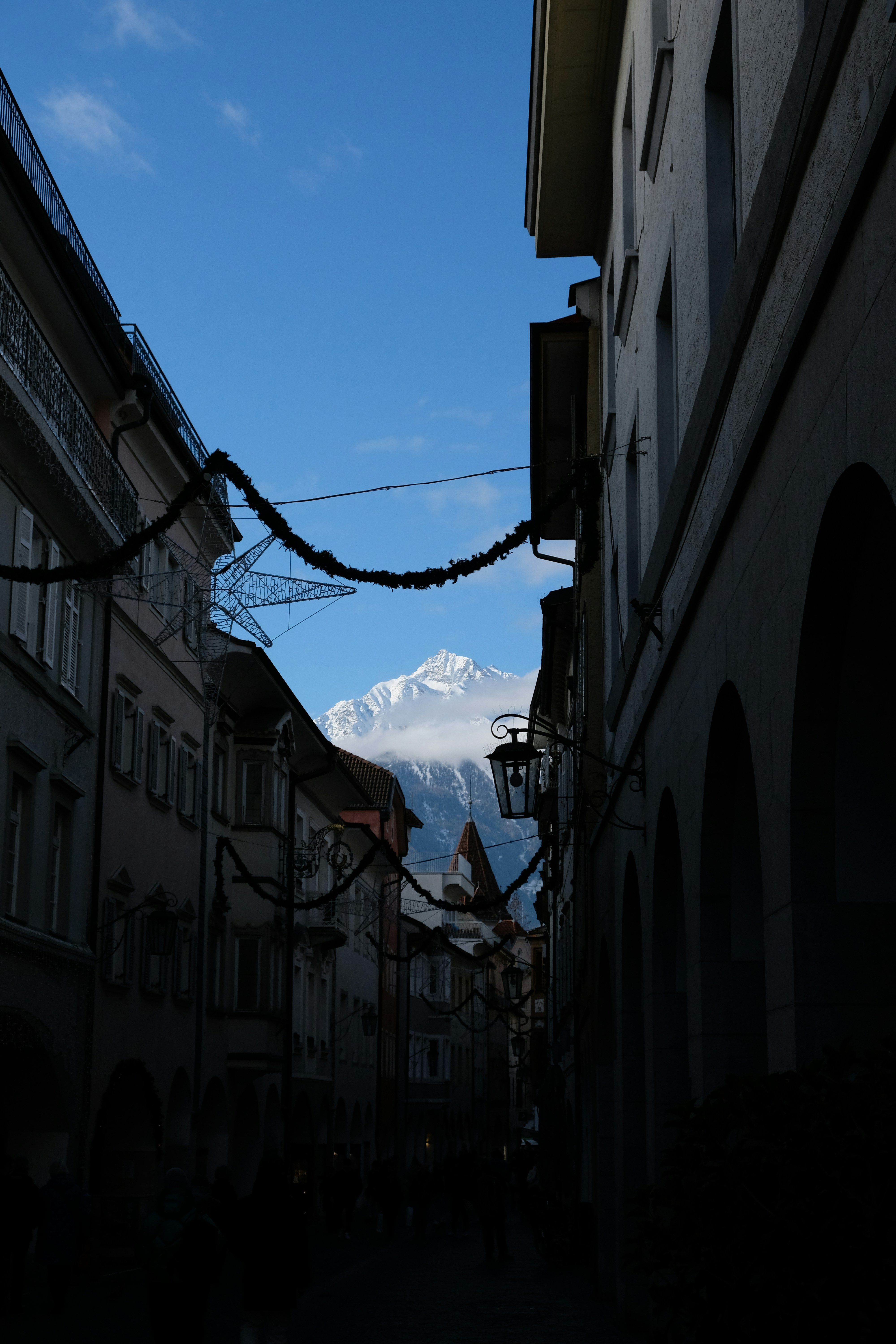 Alpine View Through Urban Arches