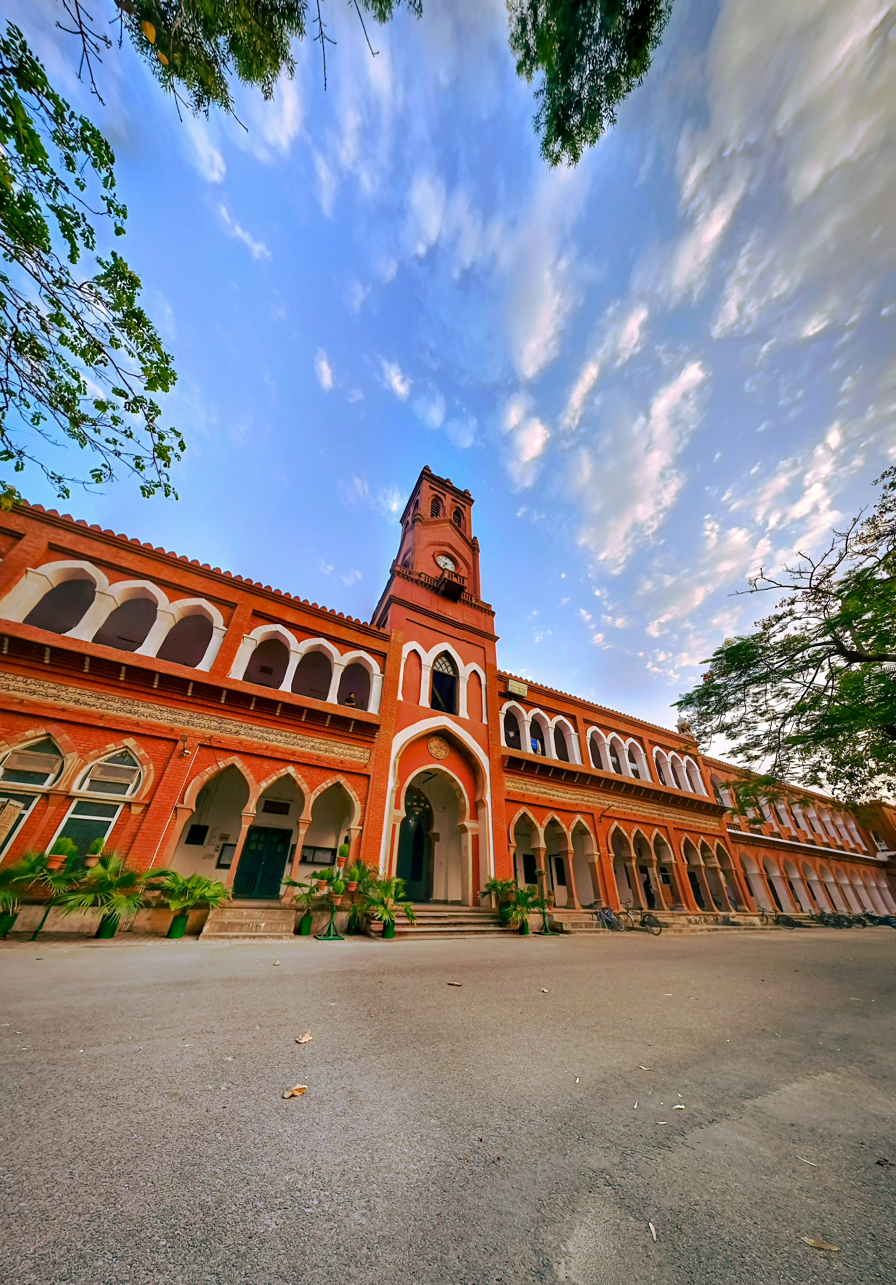 A large building with a clock tower on top of it photo – Free Victoria ...