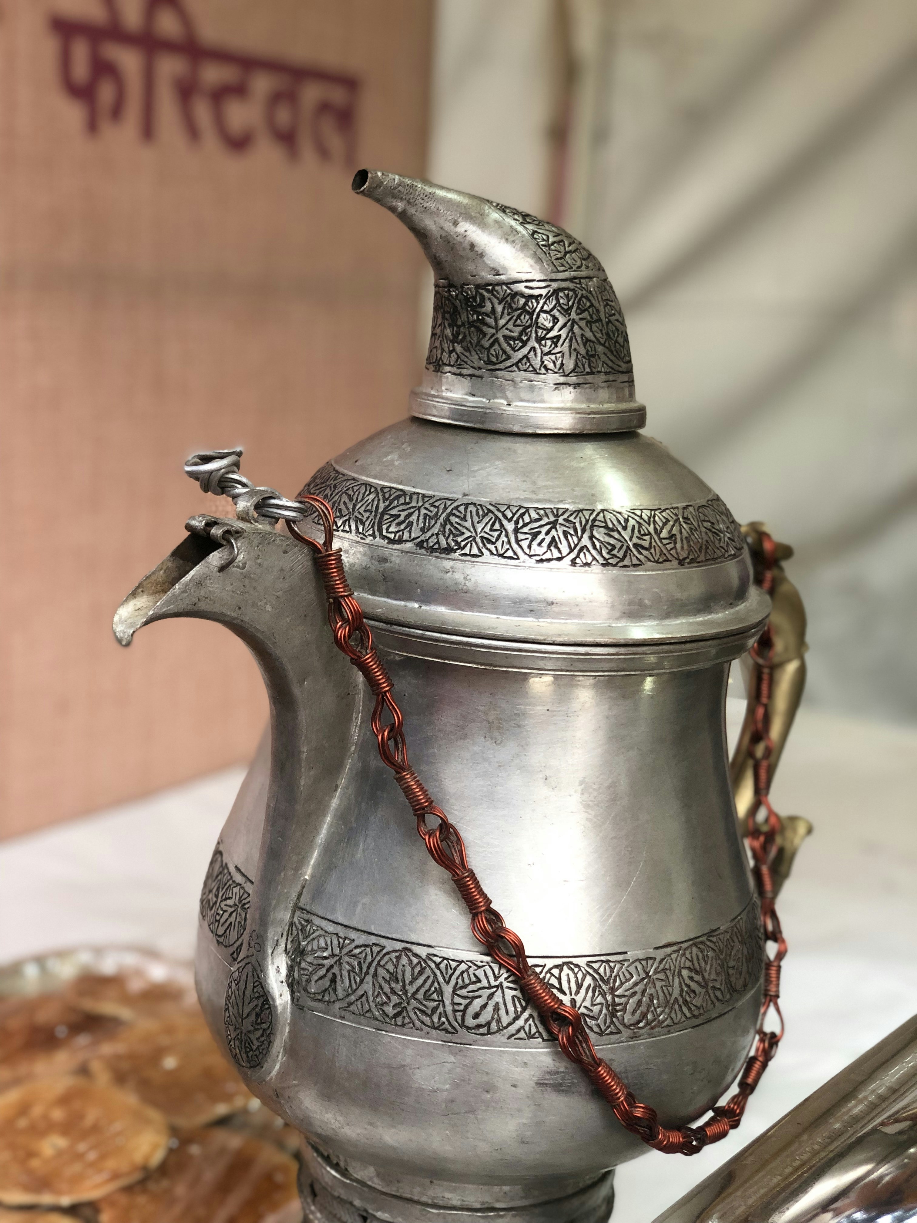 The Silver Carafe: An Ornate Coffee Pot in Quiet Focus