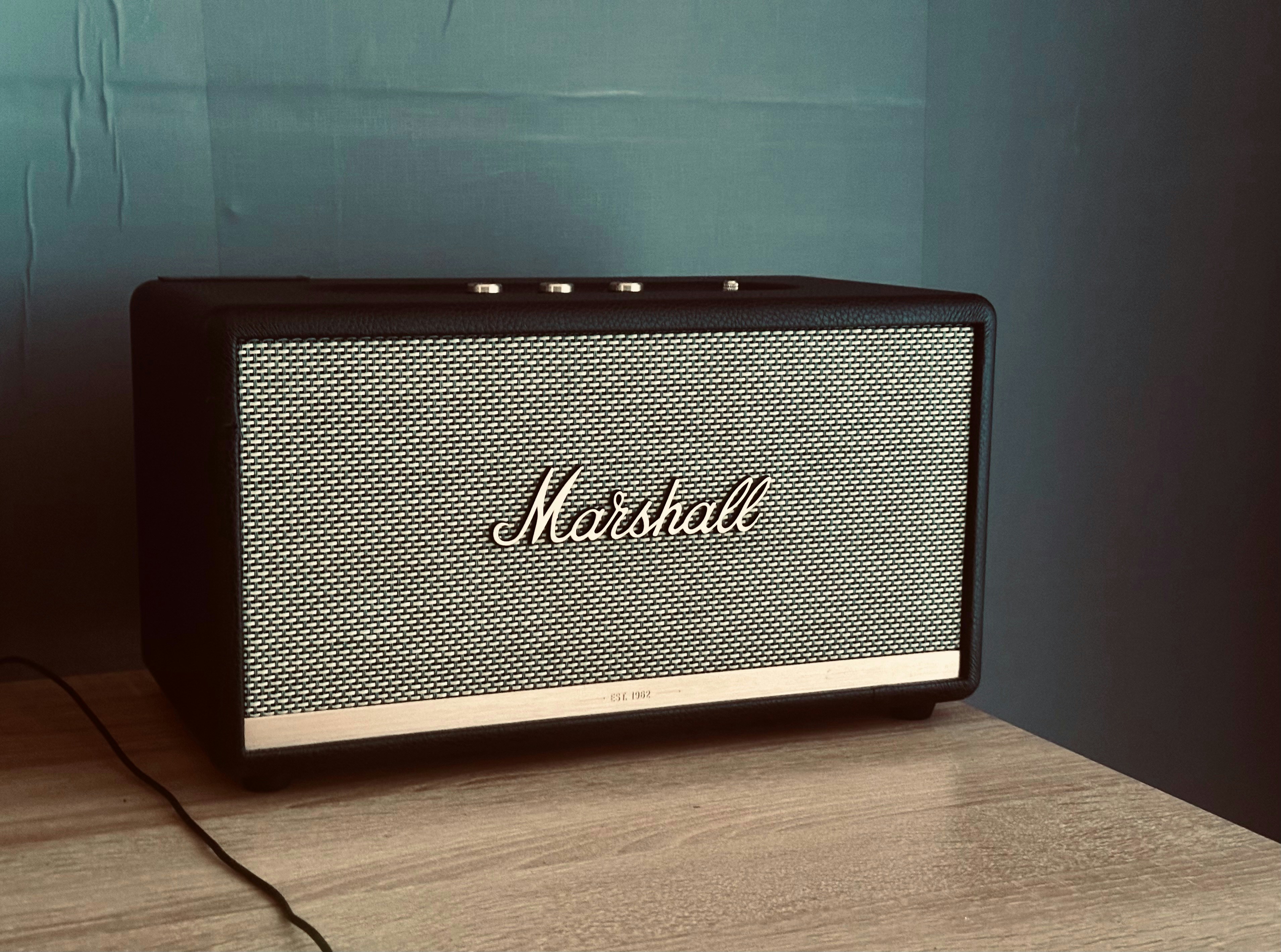 A black and white radio sitting on top of a wooden table photo – Free ...