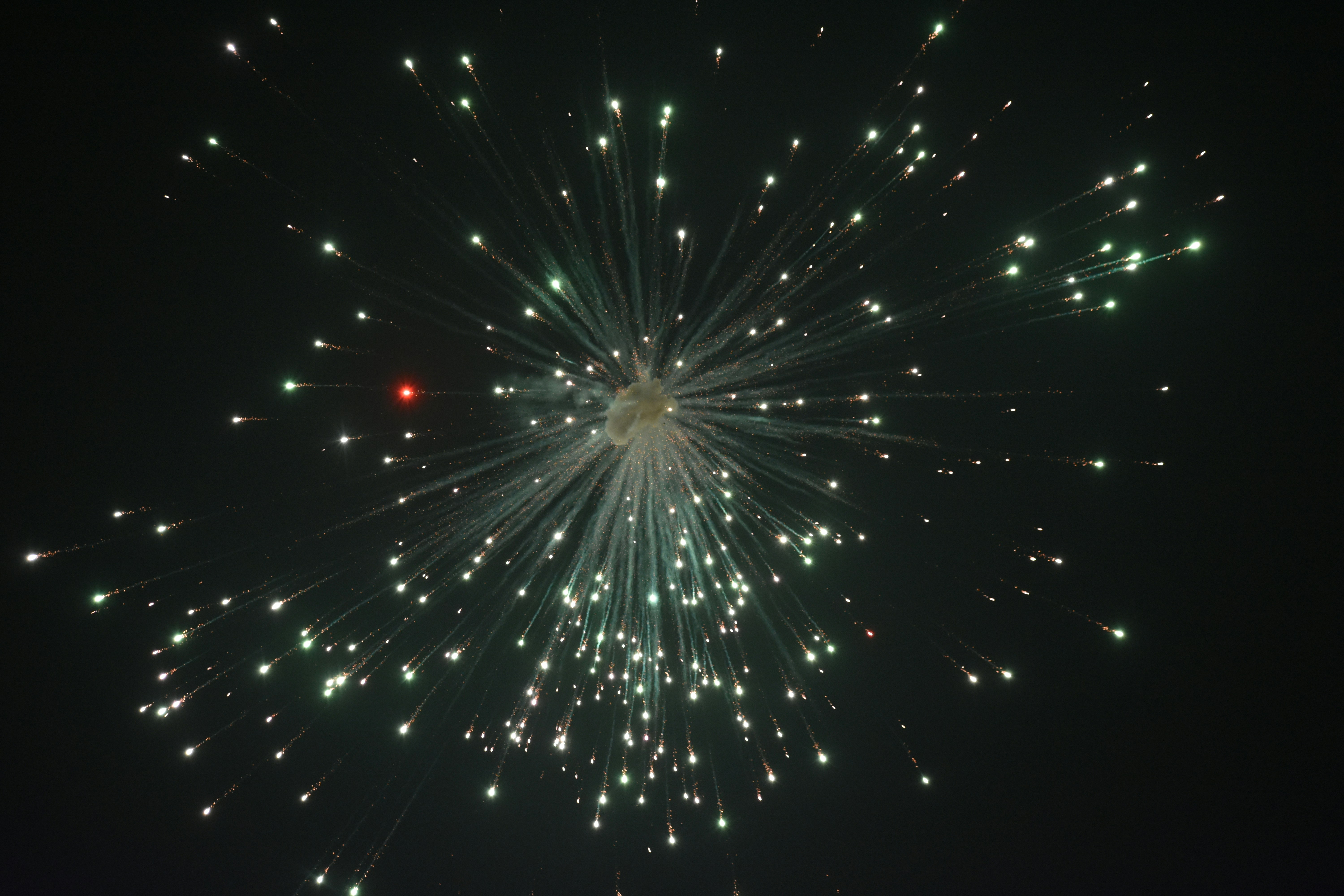 A large fireworks is lit up in the night sky photo – Free Grey Image on ...