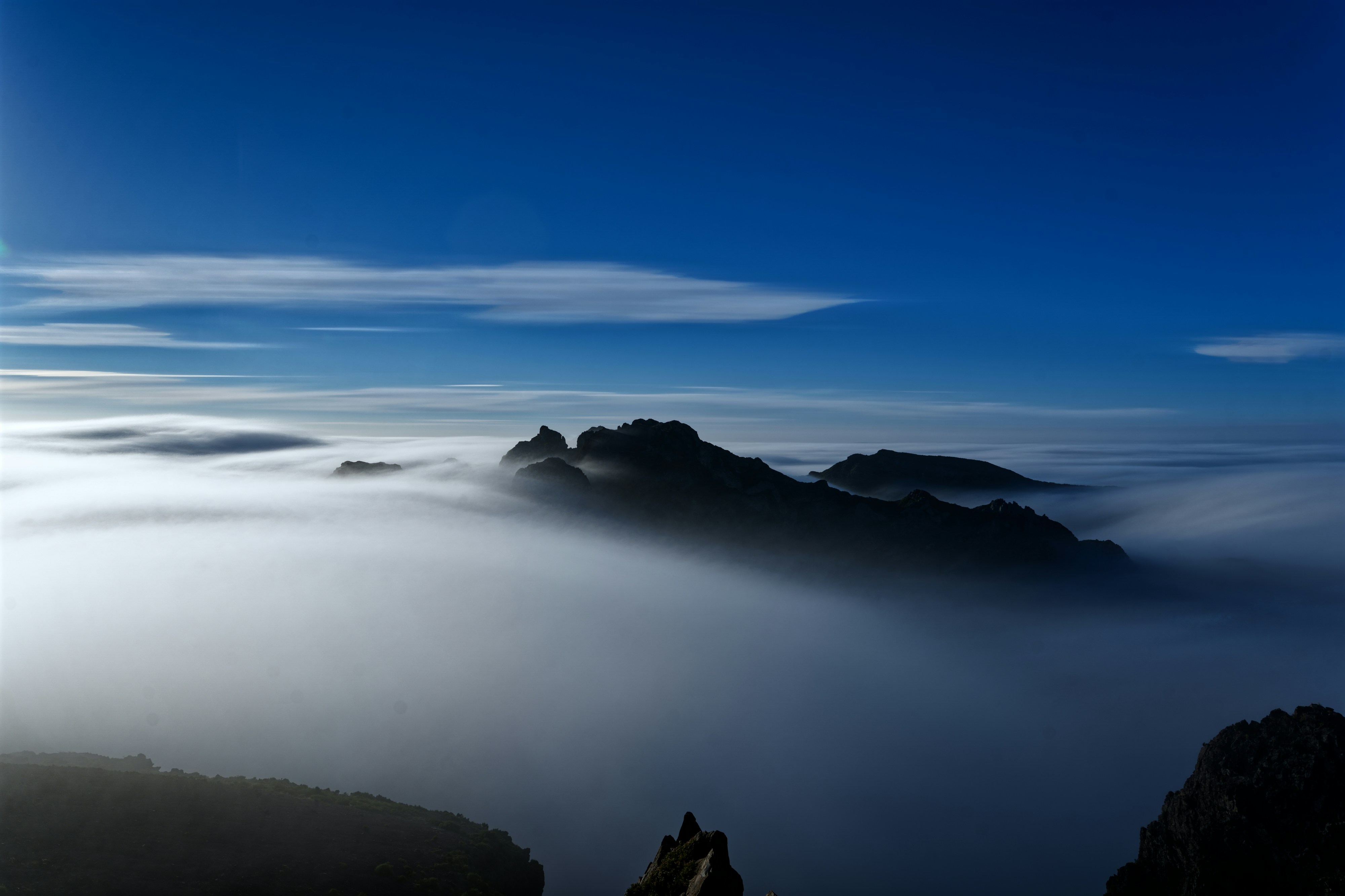 A view of a mountain covered in fog photo – Free Madeira Image on Unsplash