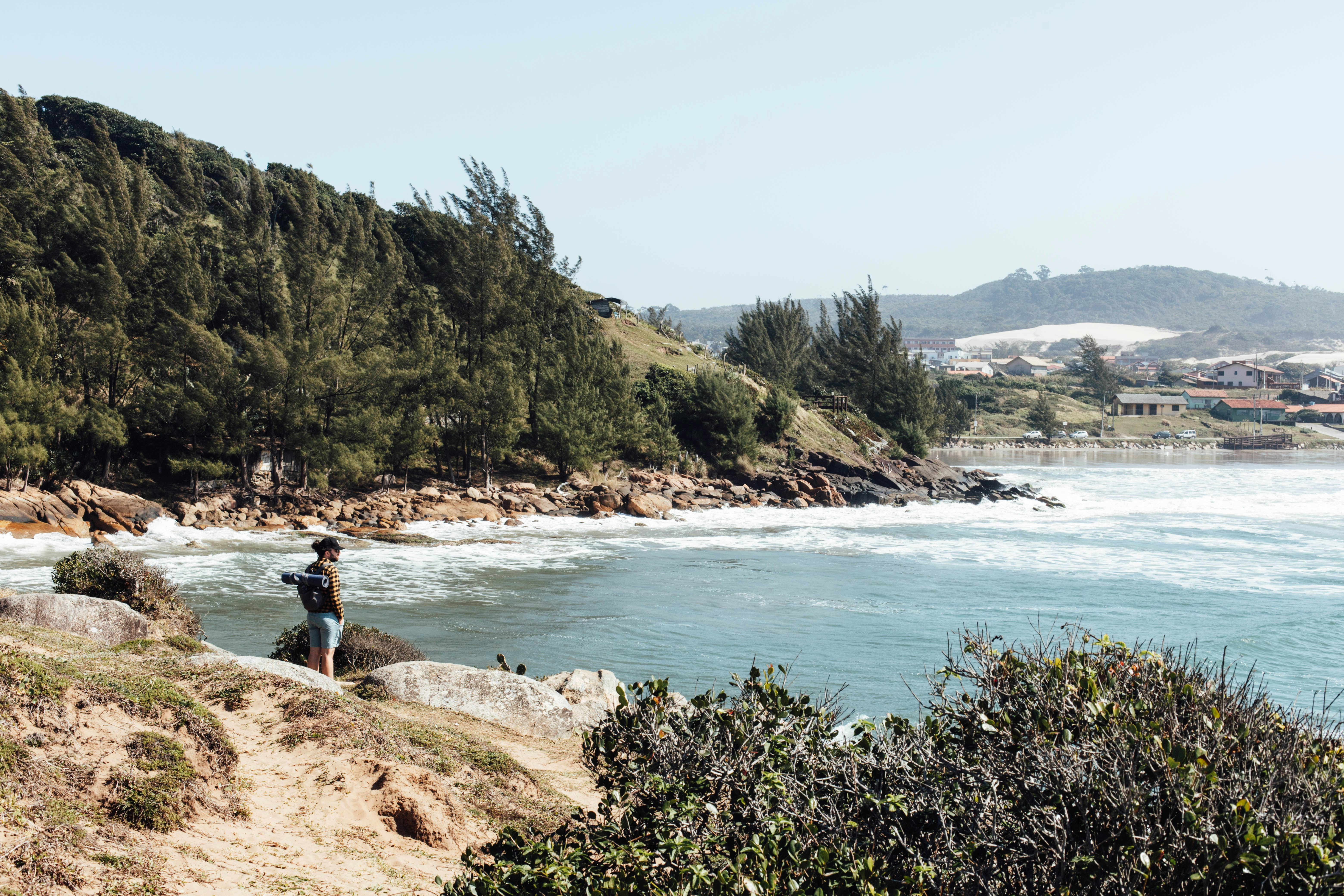 Lone Observer on a Wind-Swept Coastal Ridge
