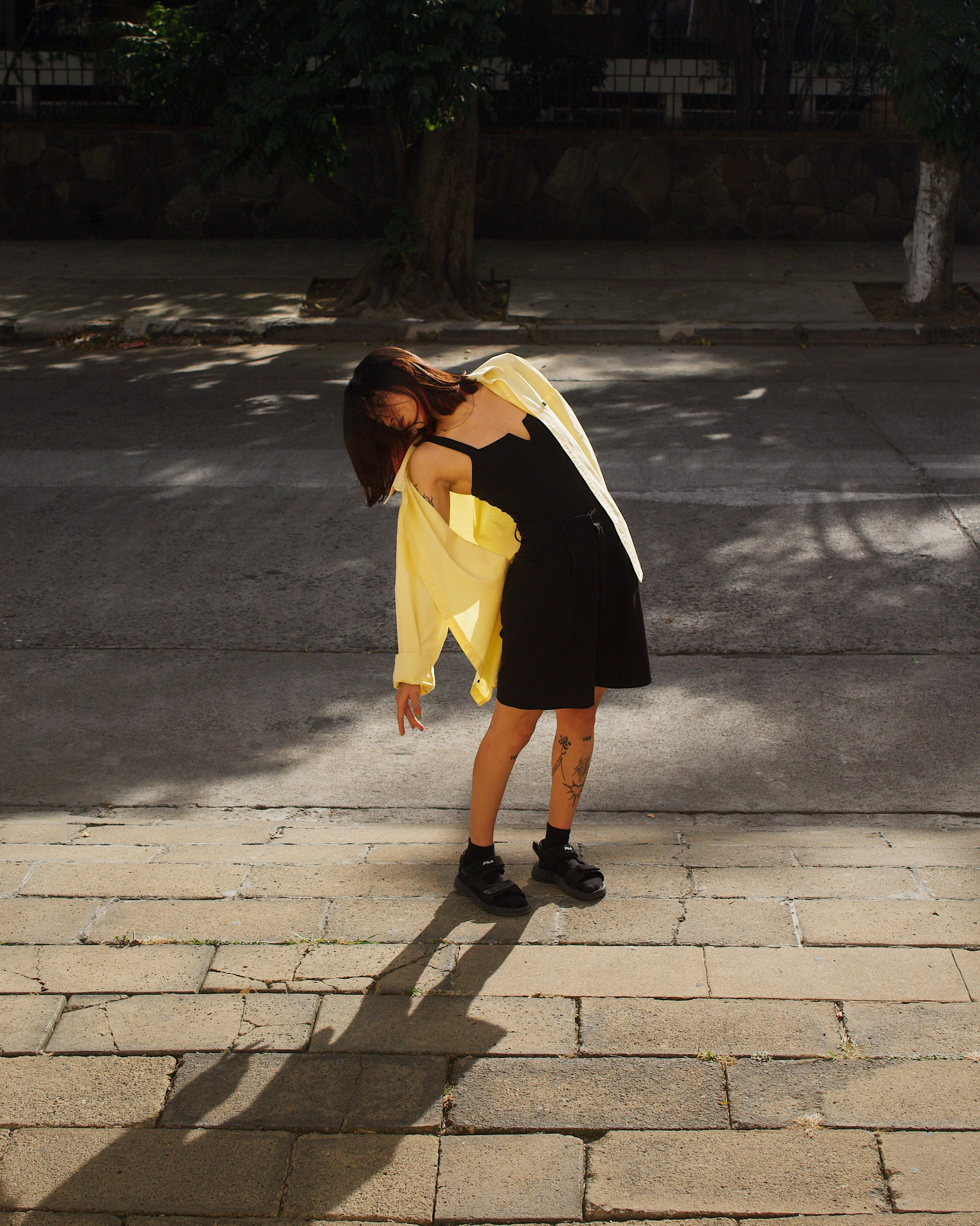 Sunlit Contemplation on Urban Pavement
