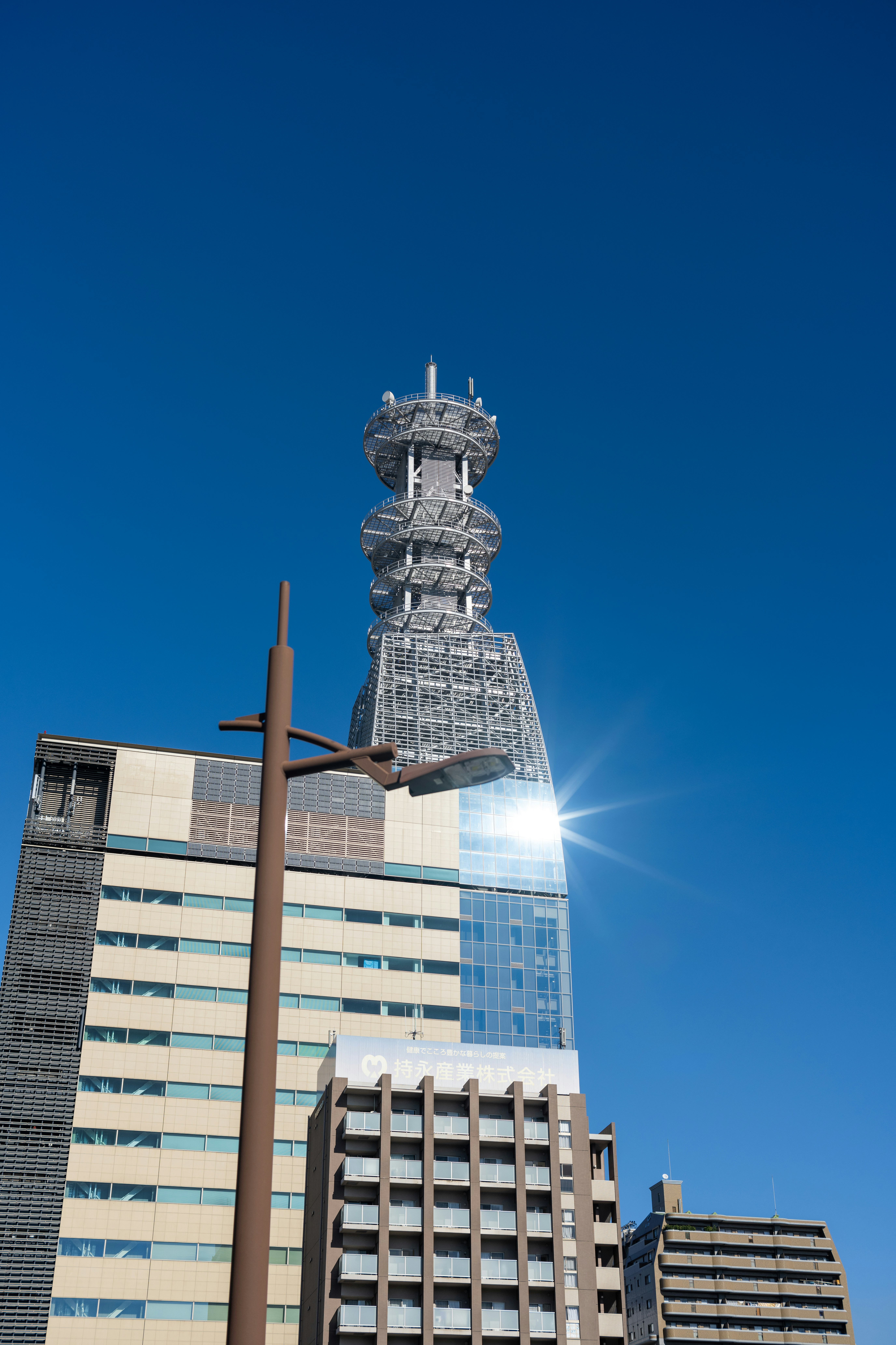 A very tall building with a very tall tower in the background photo ...