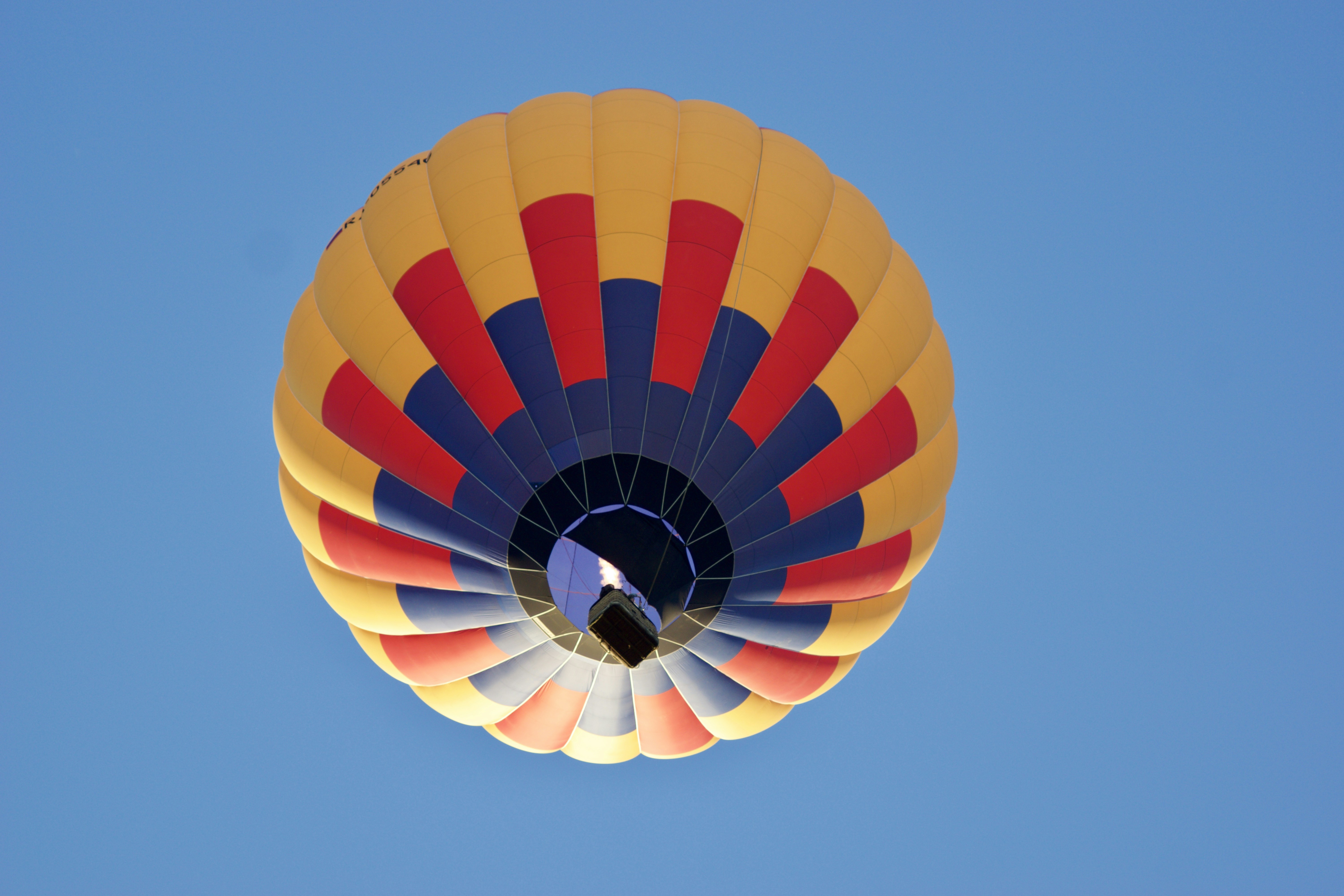 Underneath the Rainbow Dome: Multicolored Balloon Blooming Toward the Sky