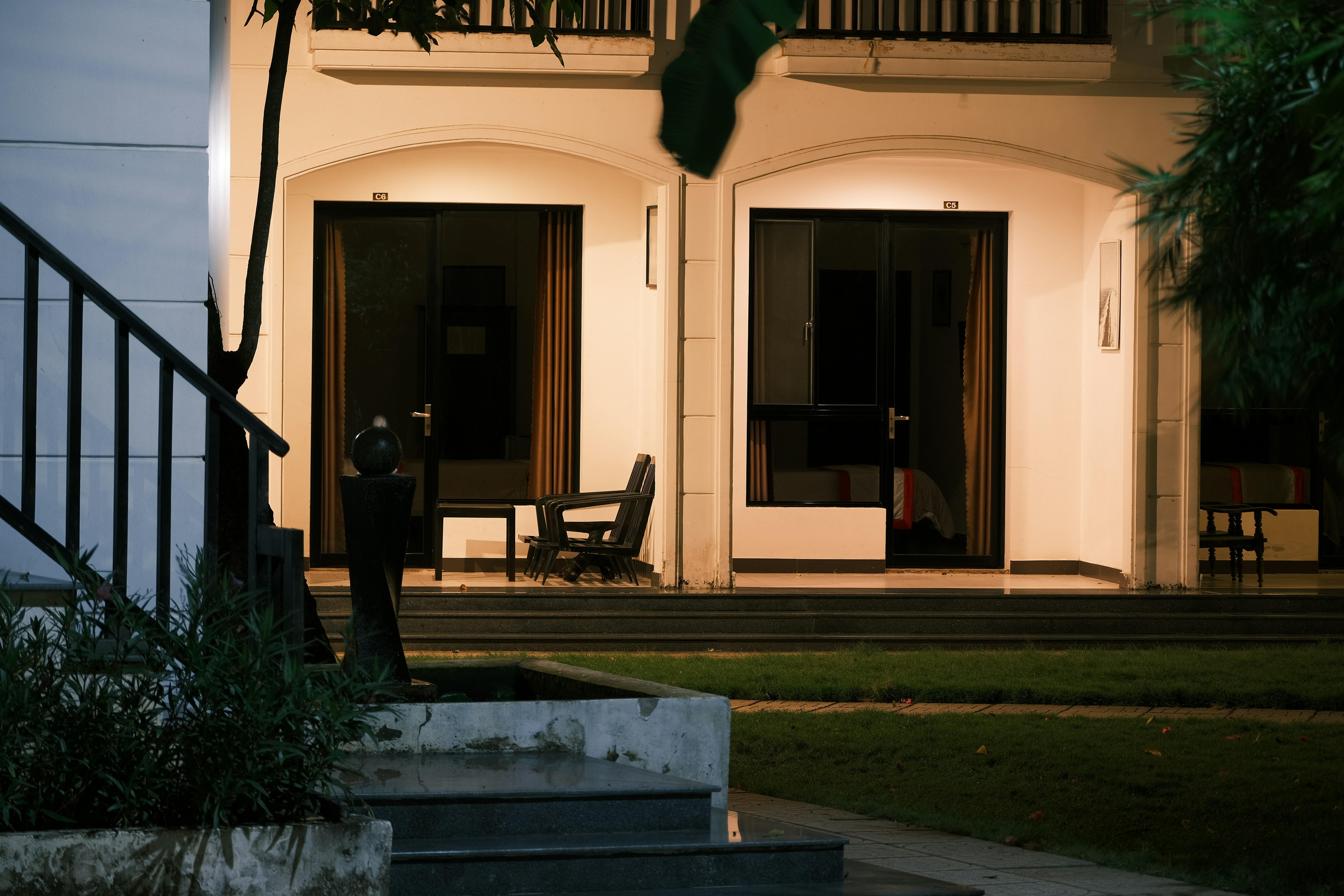 A person standing outside of a house at night photo – Free Bà rịa ...