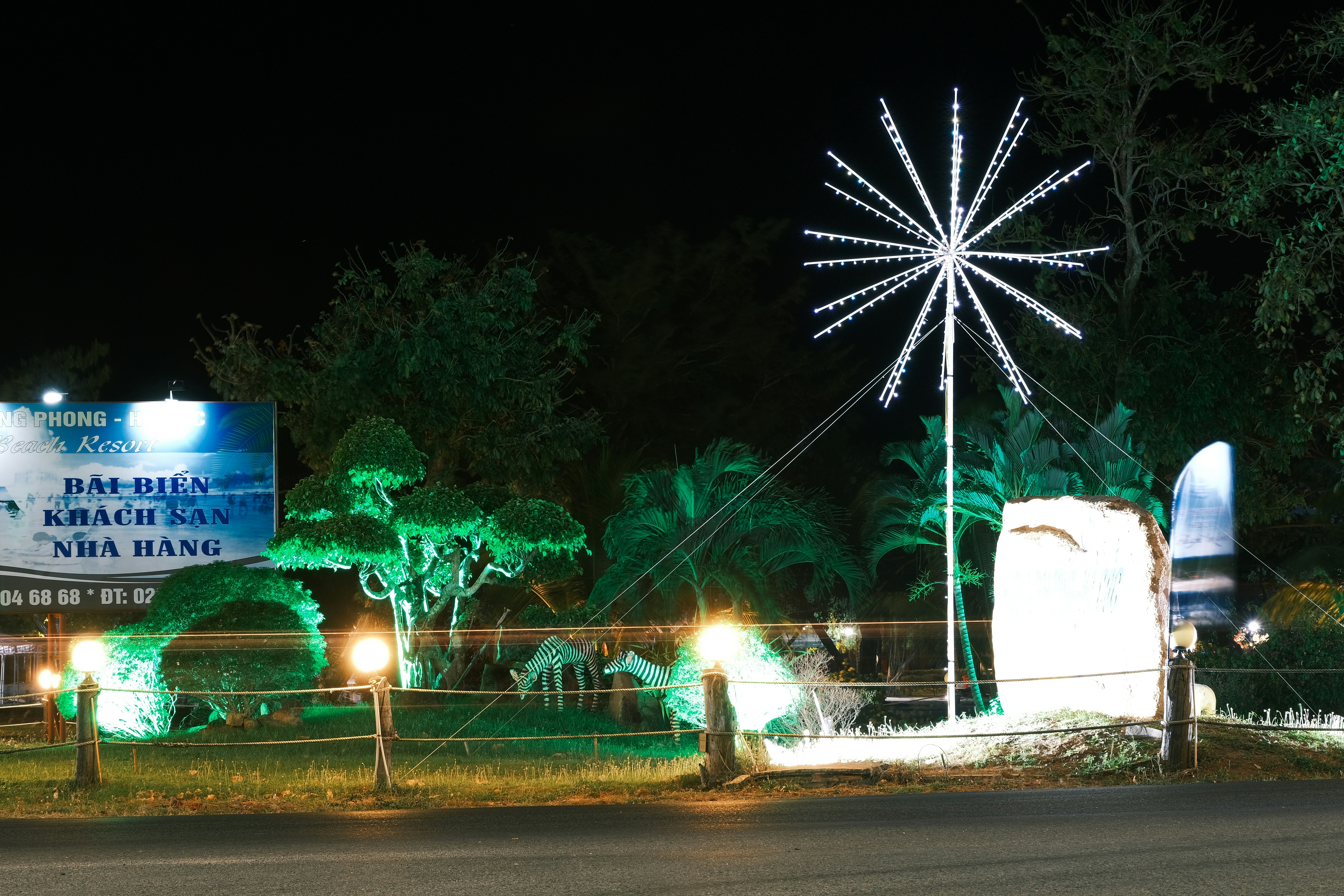 Starburst Sentinel Over Neon Nightscape by a Quiet Road