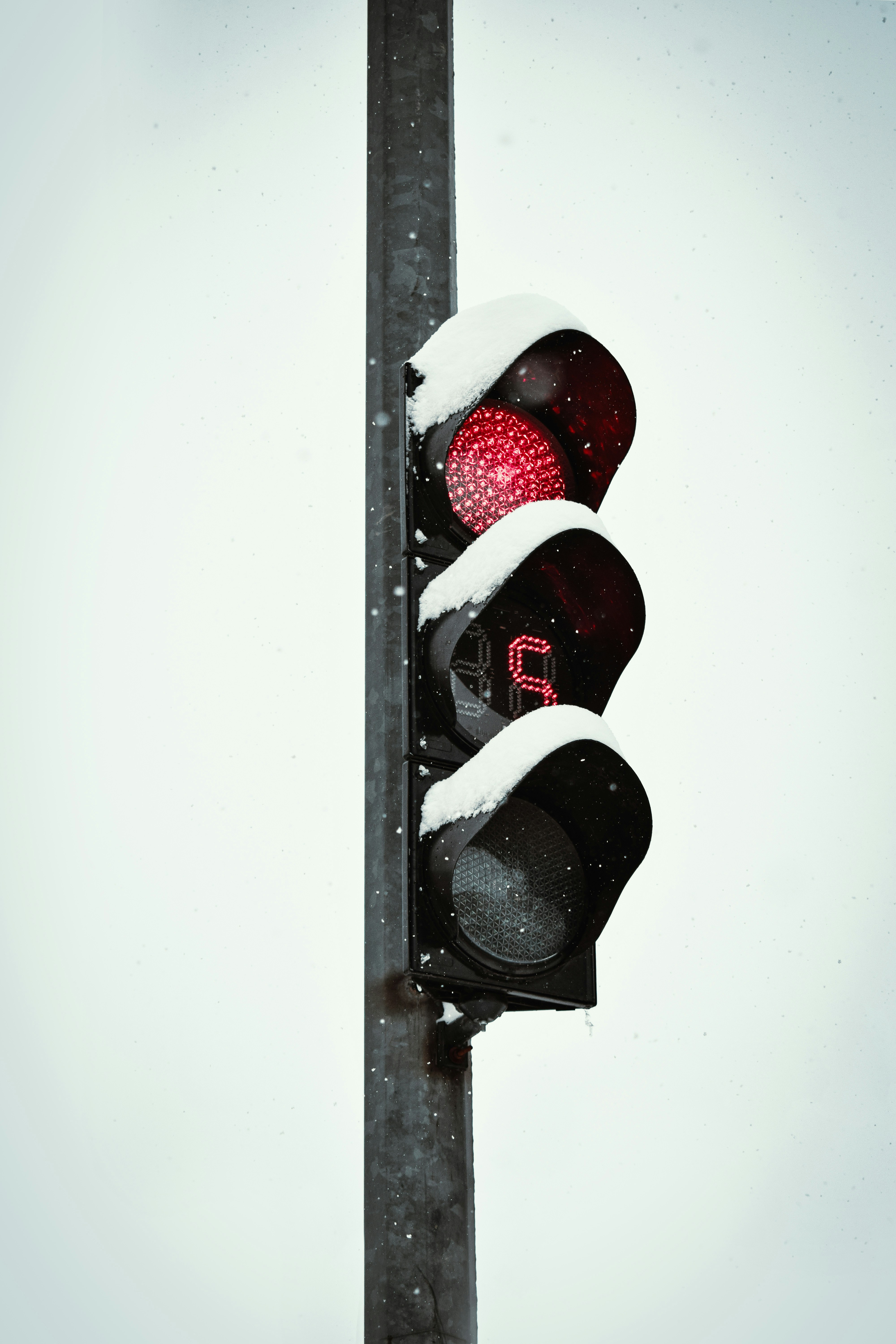 Red Signal in a Snowbound Intersection