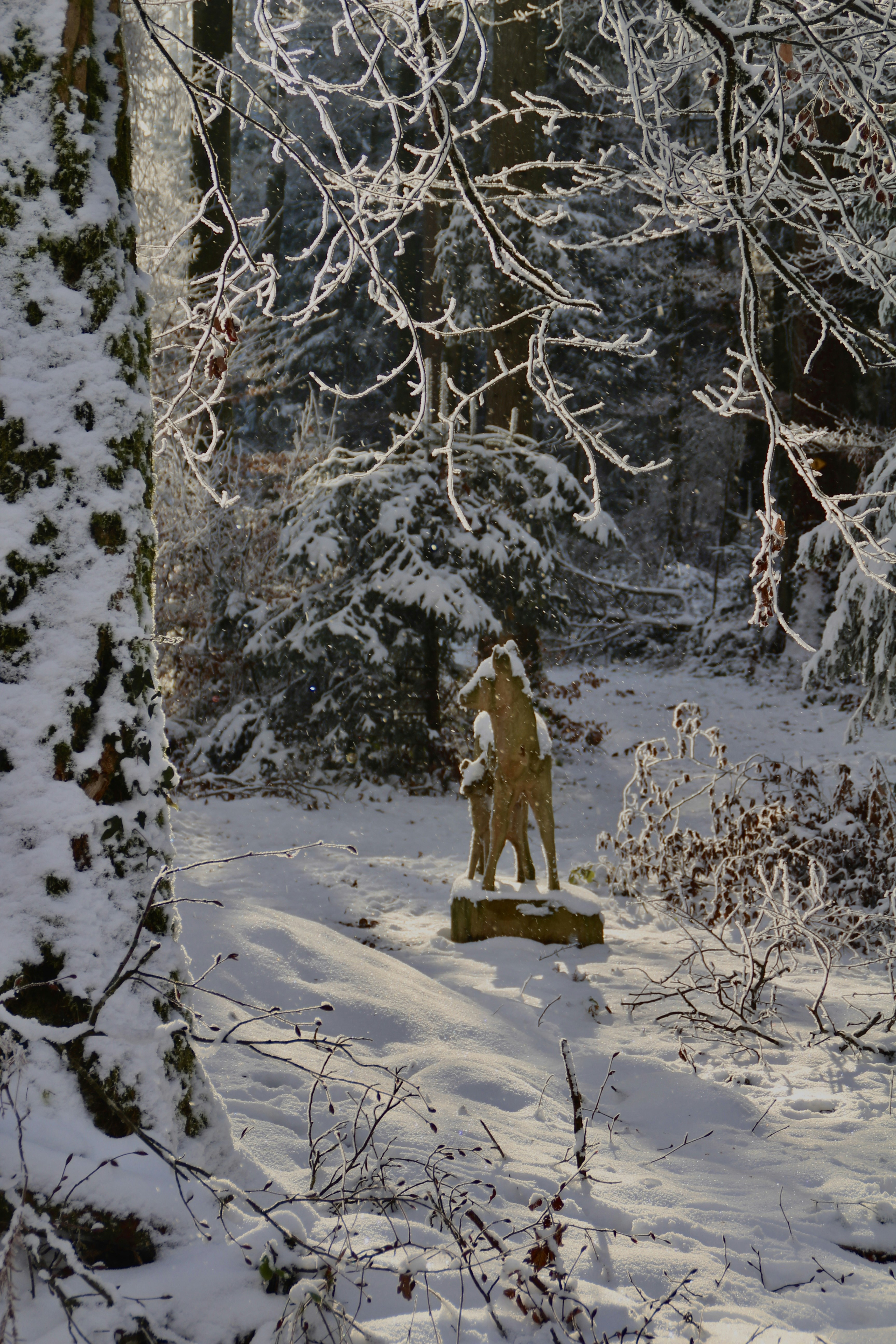 Winter Reverie: The Stone Couple Standing Silent in Snow