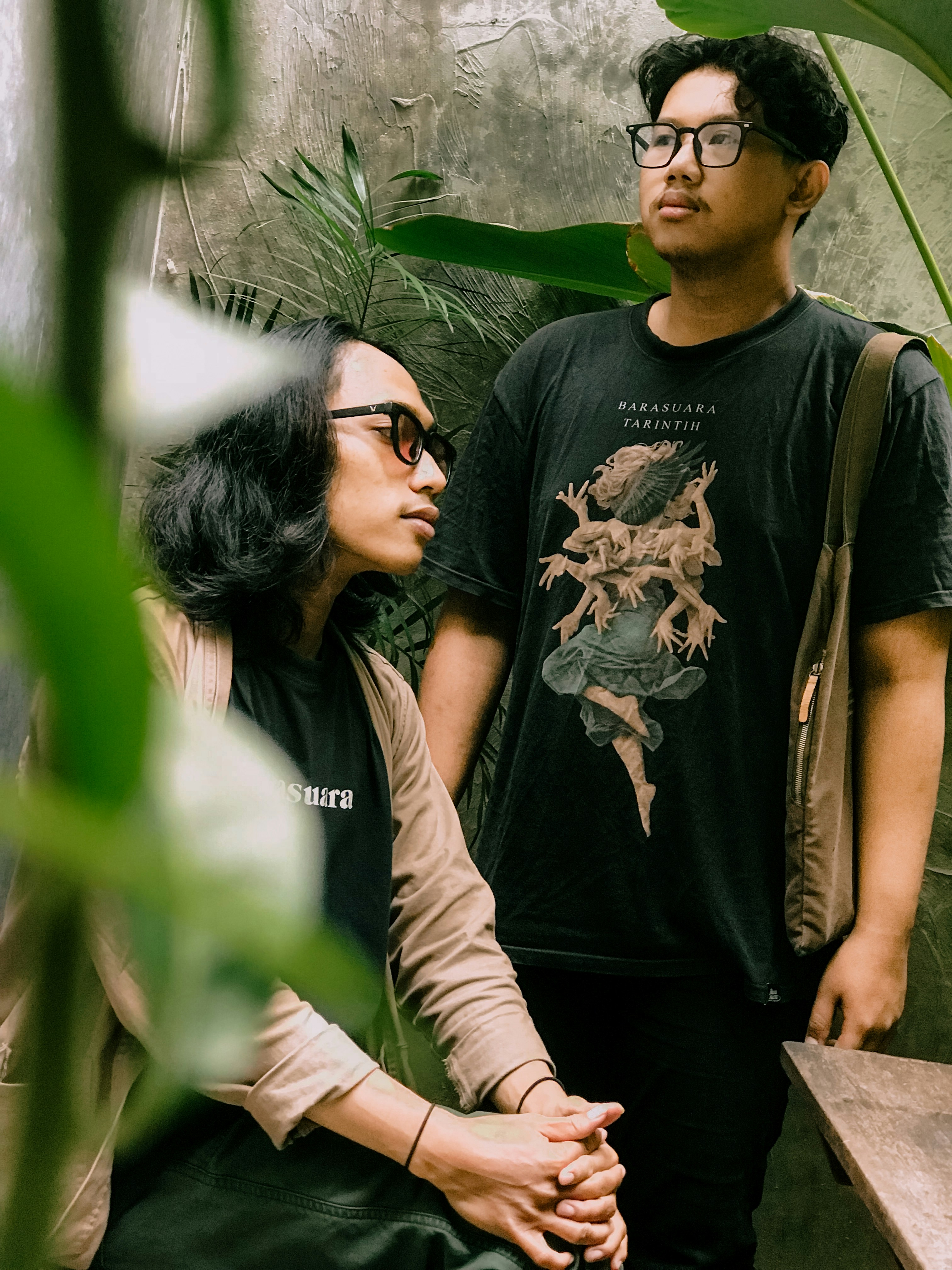 Two Friends Amid Jungle Greenery: Quiet Connection