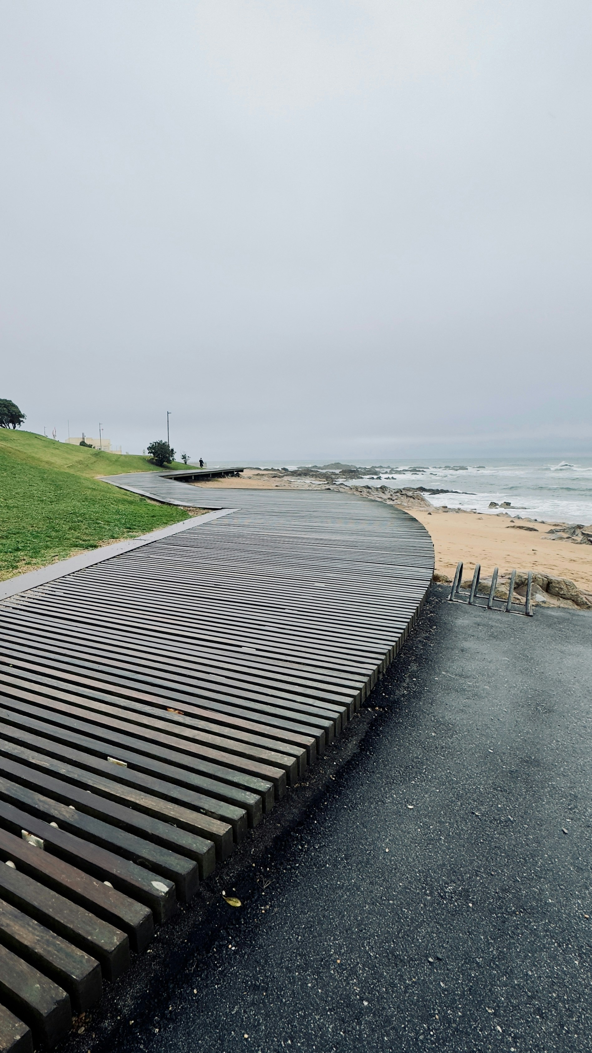 Curving Wooden Promenade Leads the Quiet Coastline