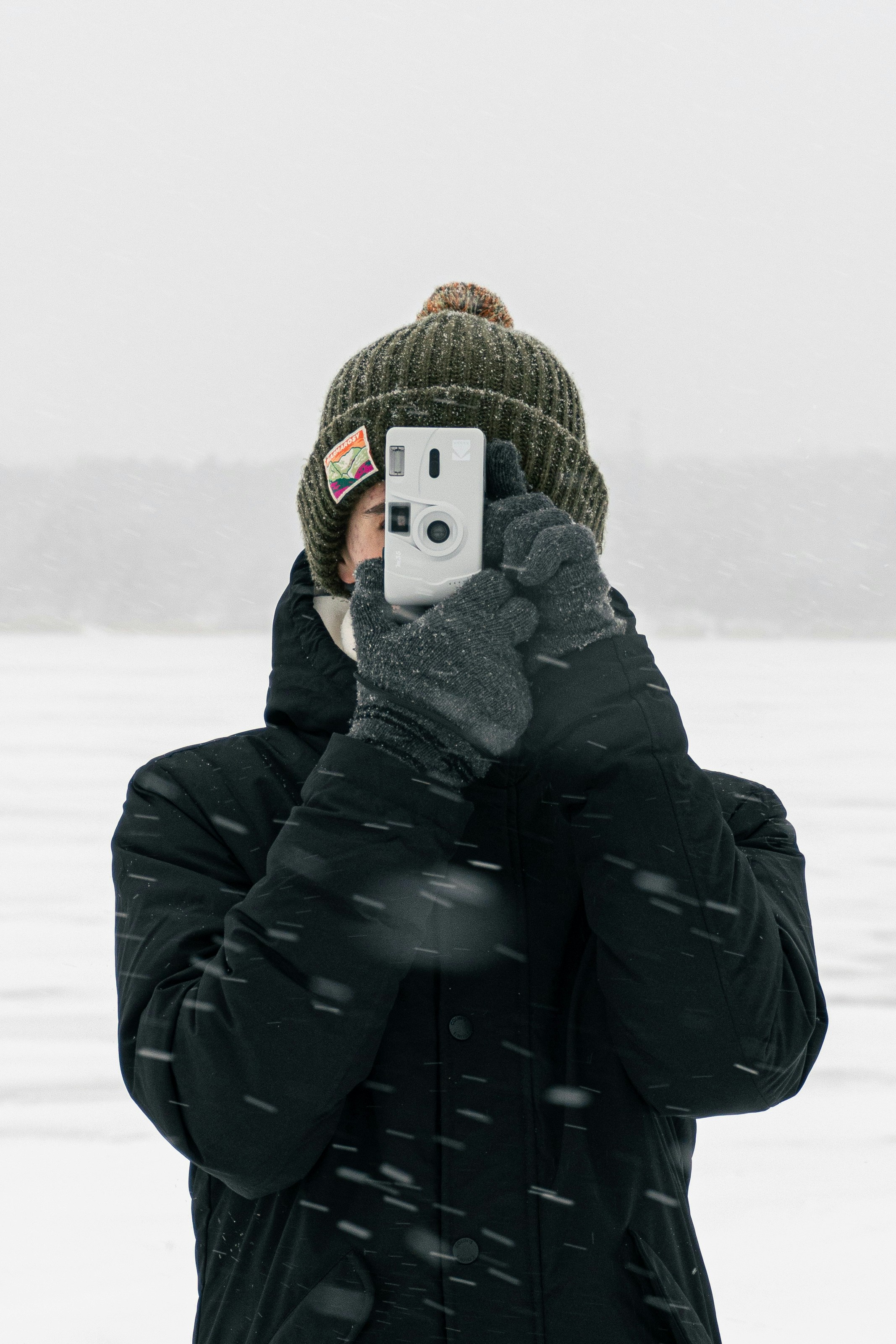 Snowlight Snapshot: A Winter Moment Framed by a Tiny White Camera