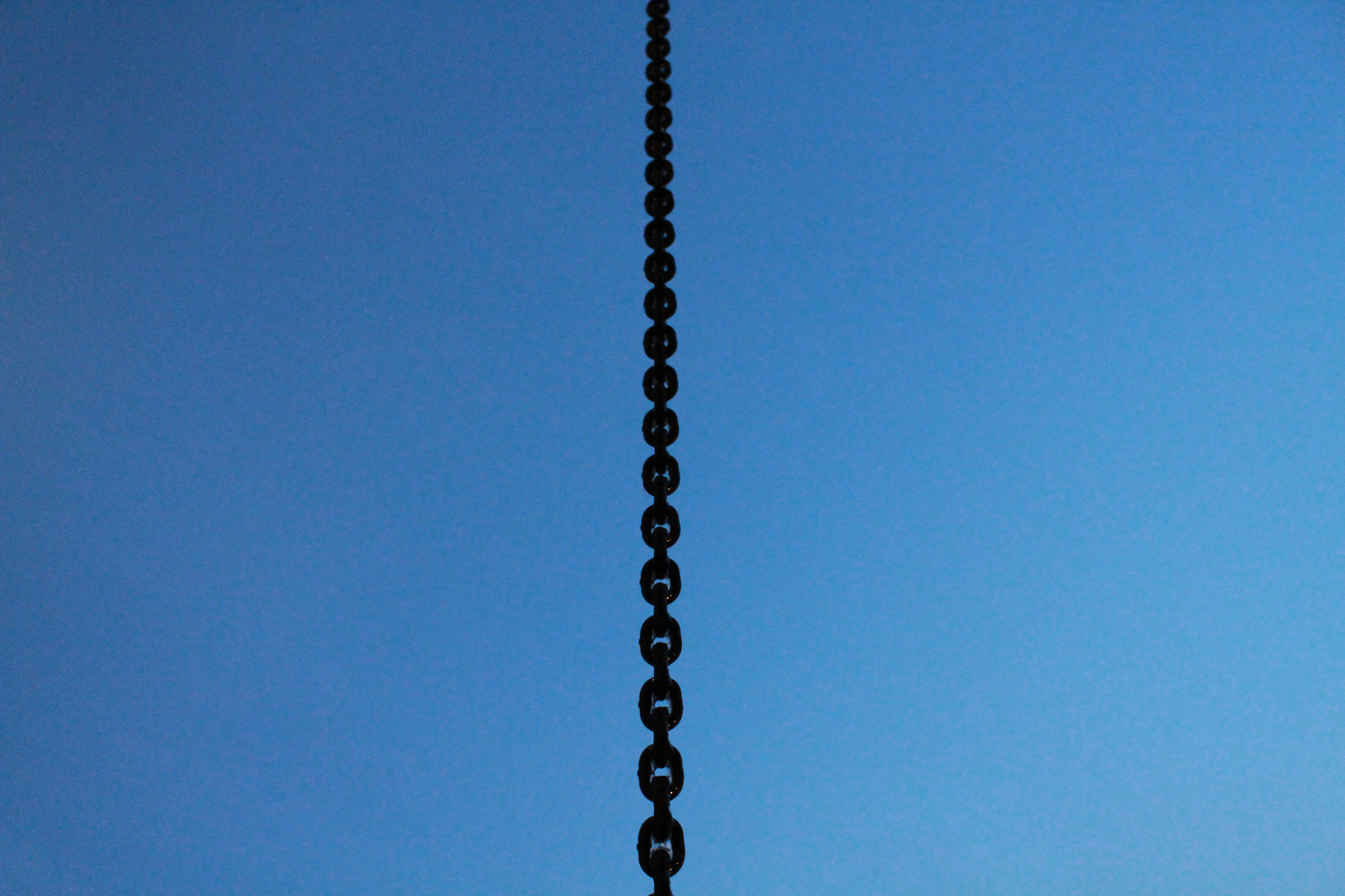 Vertical Bead Chain Against a Clear Blue Sky