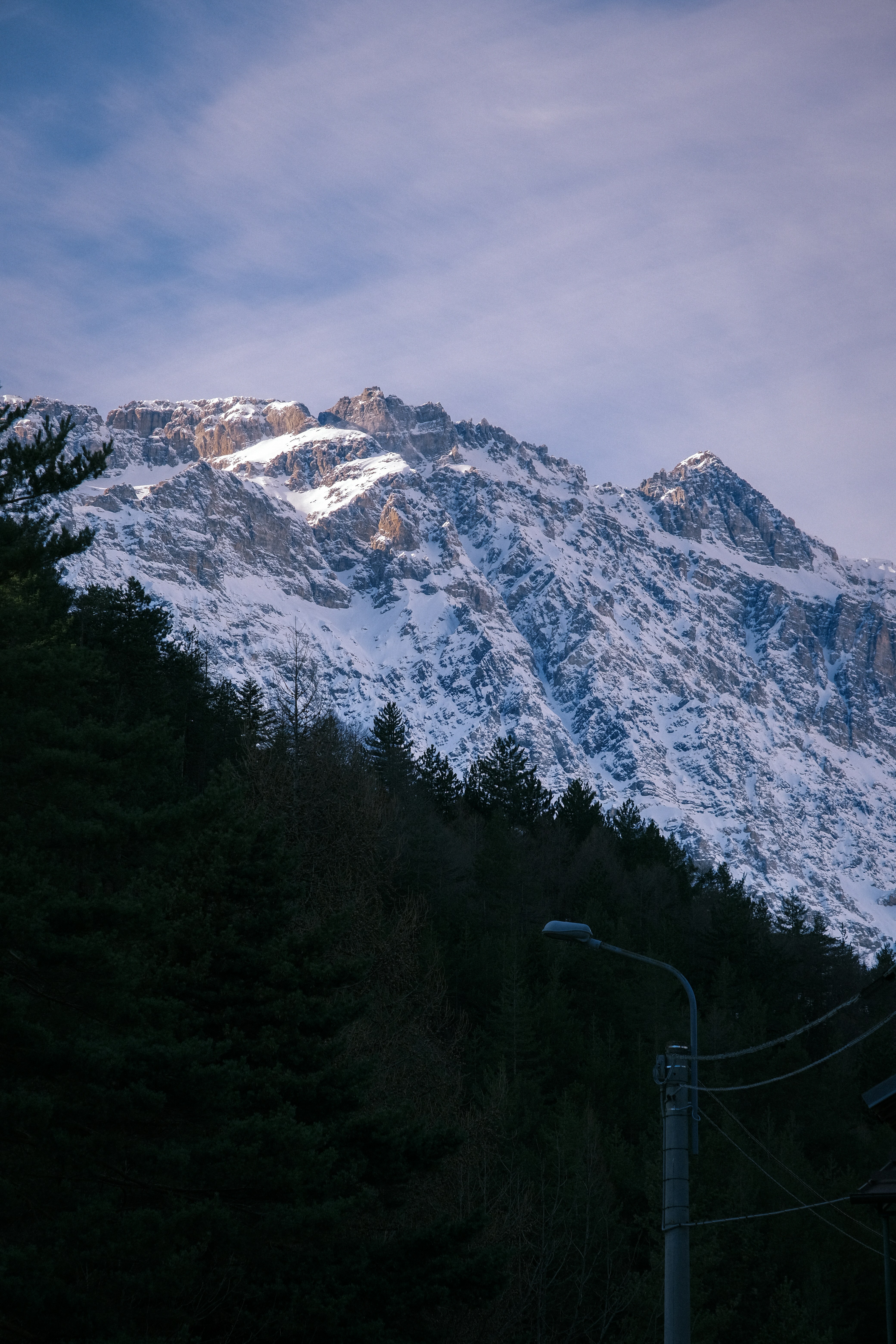 Snow-Kissed Summit Under a Quiet Skies