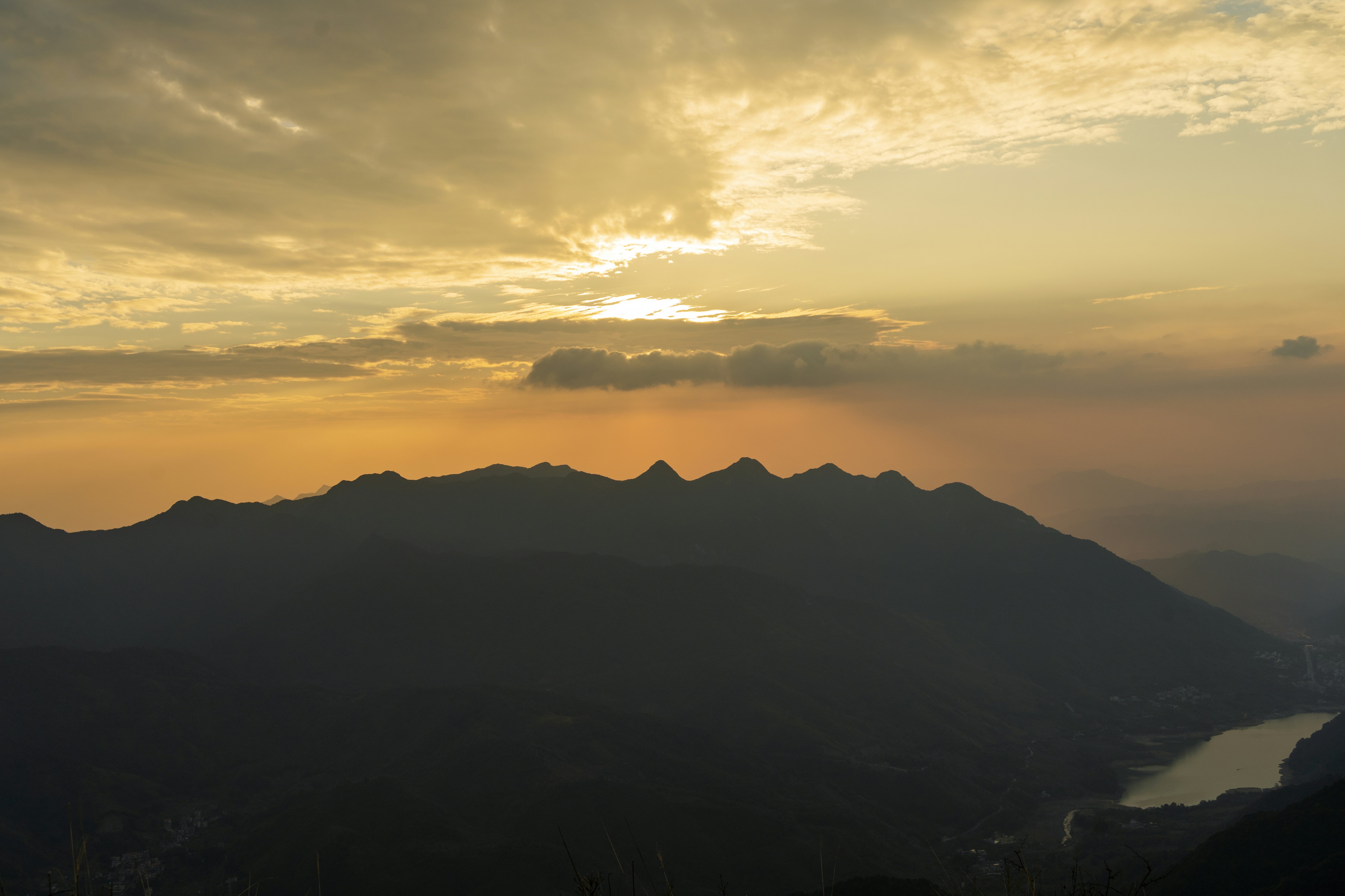 The sun is setting over a mountain range photo – Free Jizhen mountain ...