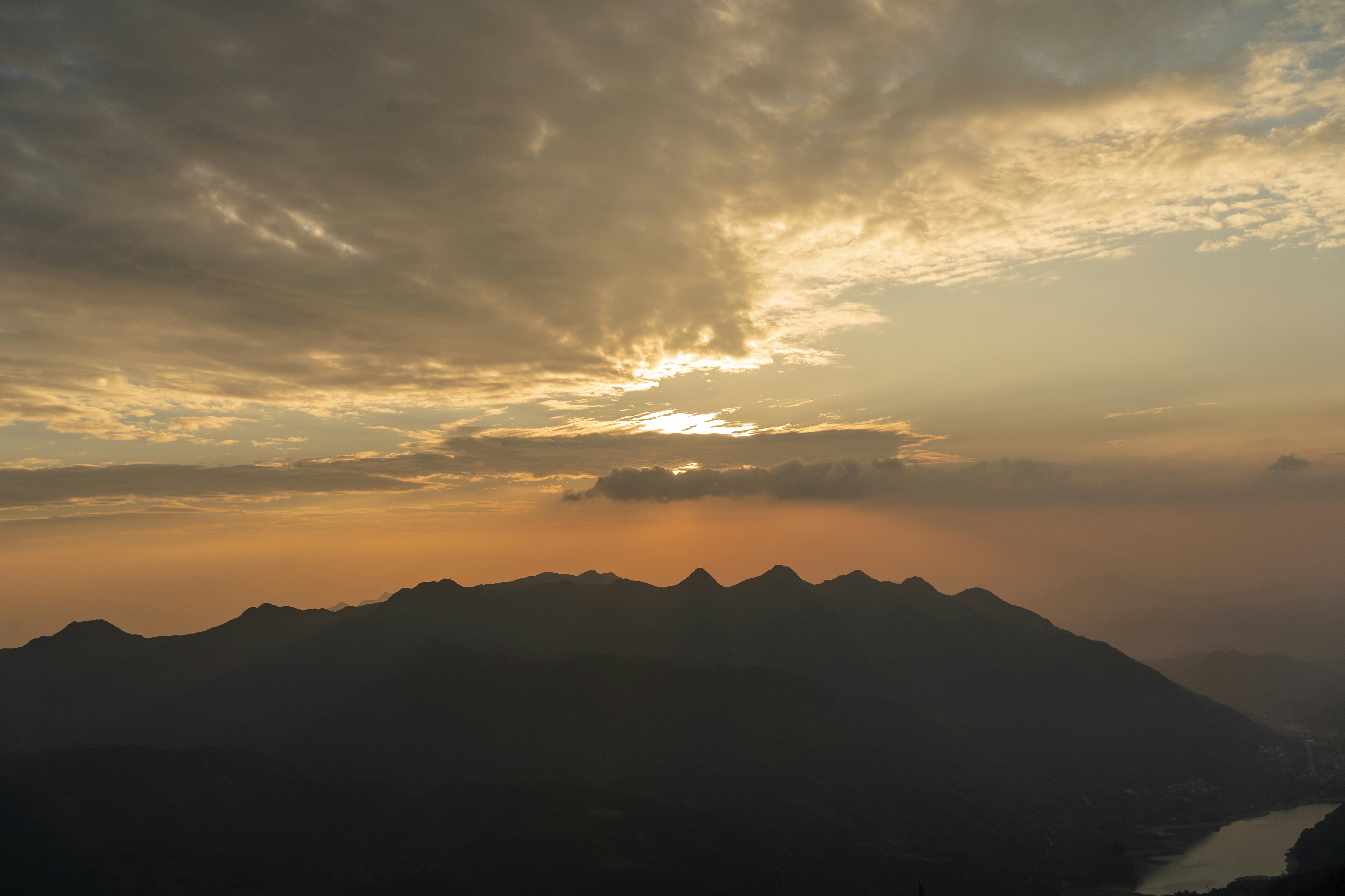The sun is setting over a mountain range photo – Free Jizhen mountain ...