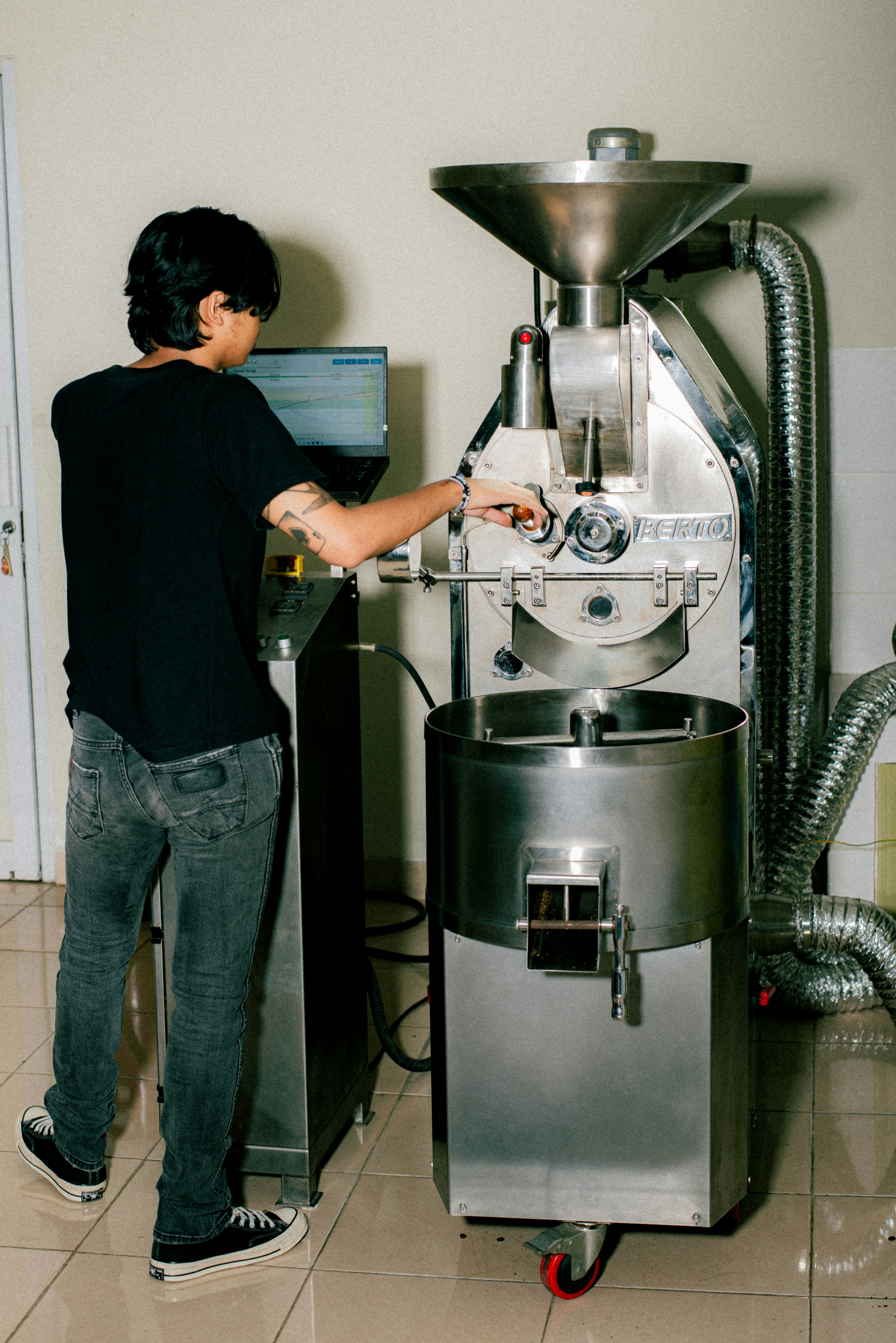 Operator at a stainless-steel grinder: focus, control, and precision