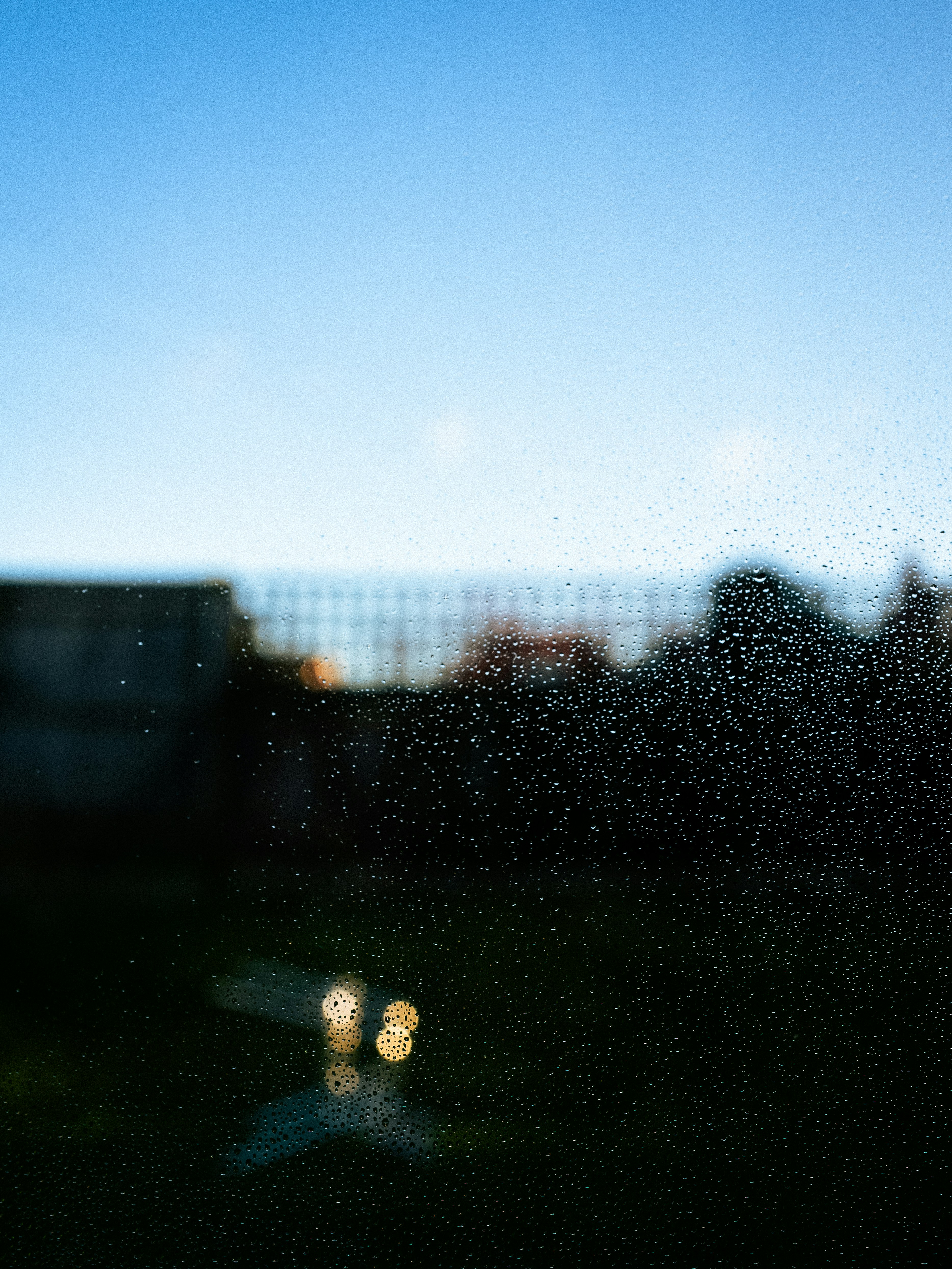 Morning Dew on Glass with Urban SilhouetteMetin Ozer