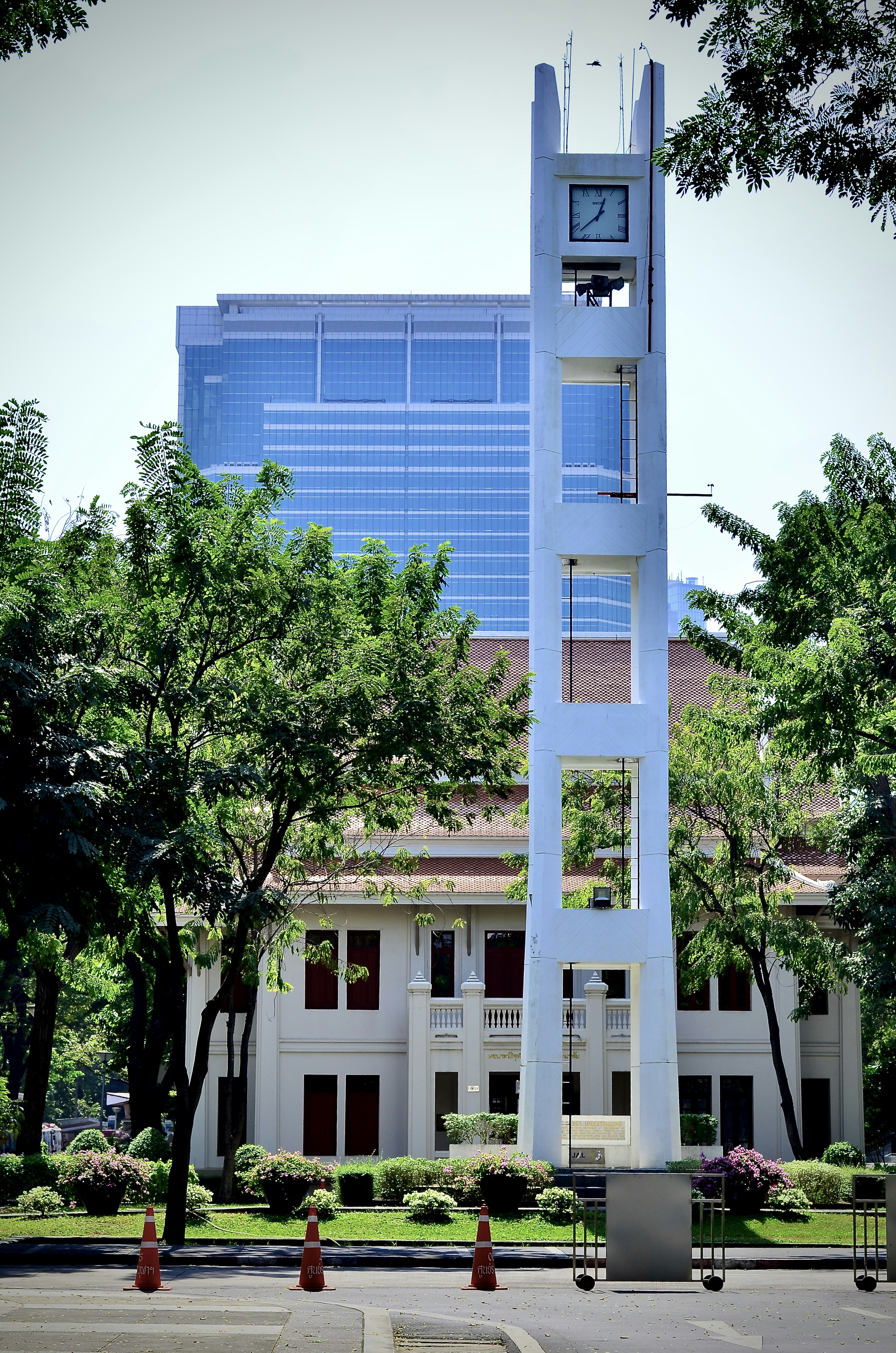 A tall clock tower sitting in front of a building photo – Free City ...